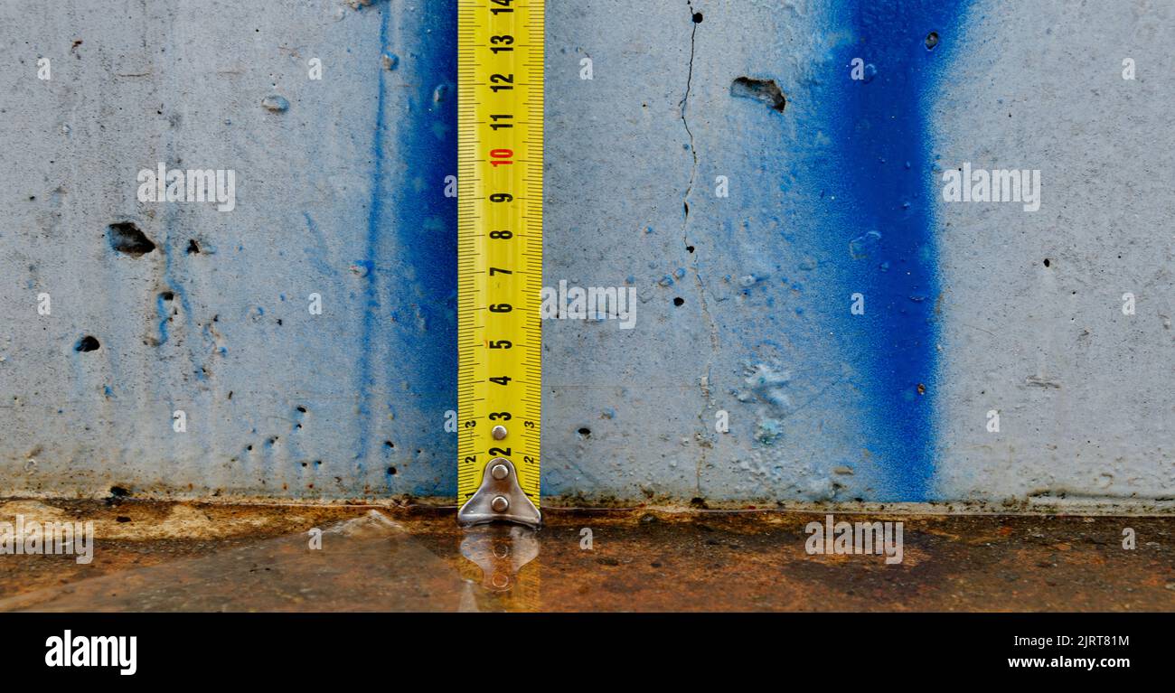 Measuring ruler on a concrete wall texture. The concept of renovation ...