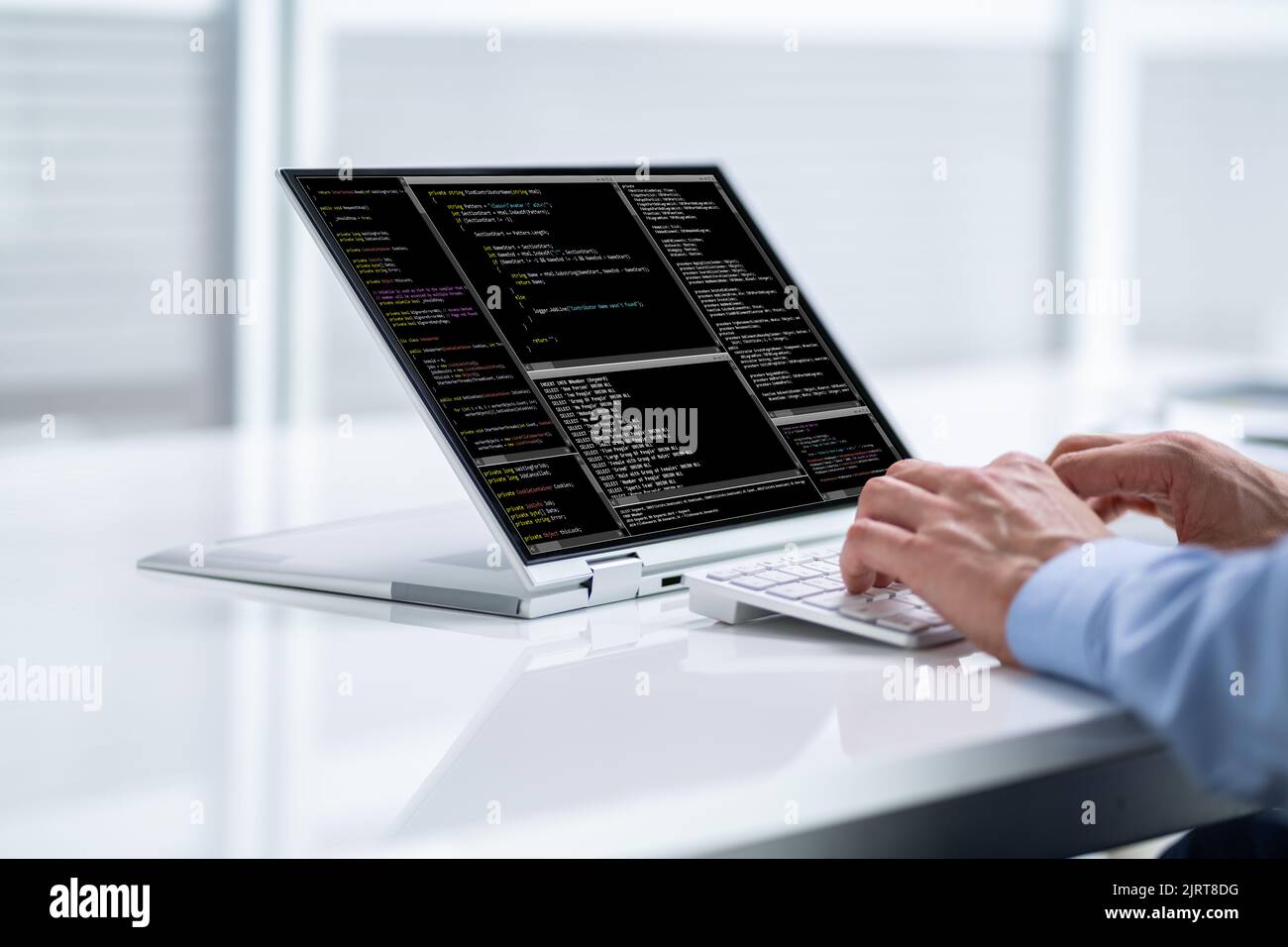 Computer Programmer Using Development Software On Laptop Stock Photo - Alamy