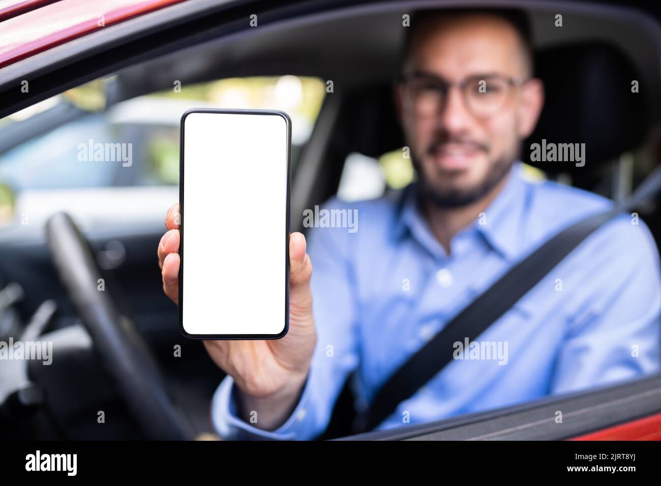 Man Hand Showing Mobile Phone In Car Stock Photo - Alamy