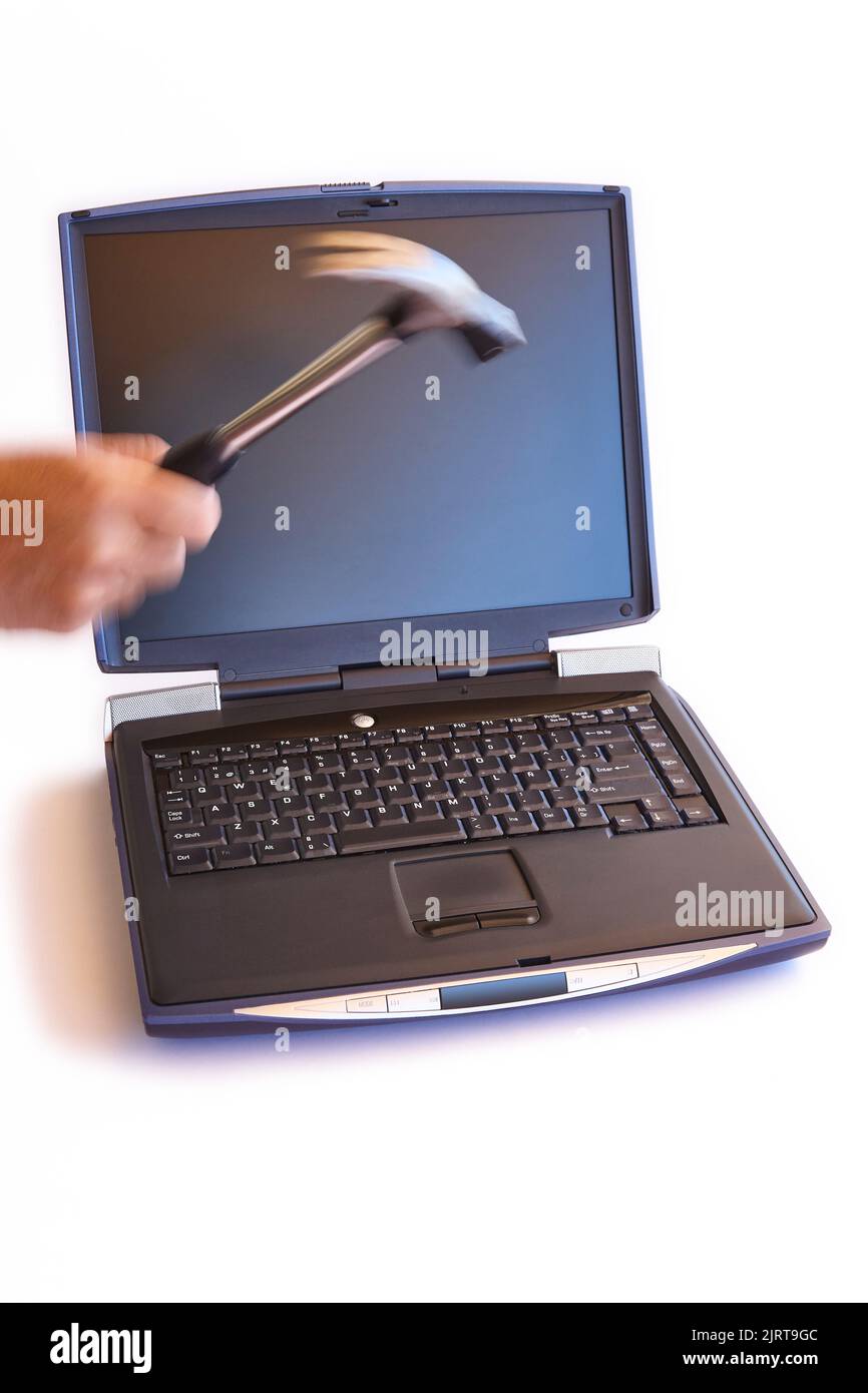 Workaholic. Man destroying a computer with a hammer. Isolated Stock ...