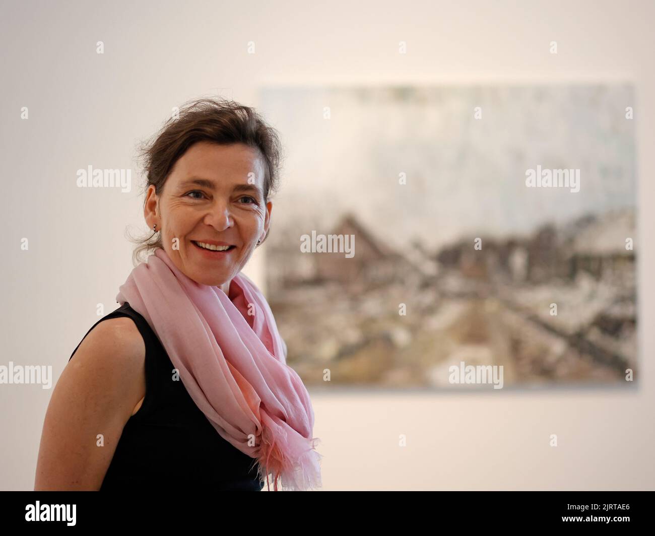 Quedlinburg, Germany. 26th Aug, 2022. Artist Sabine Moritz stands in an ...