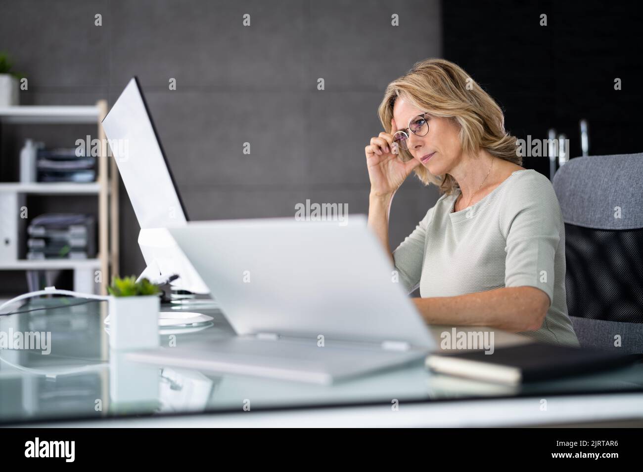 Depressed Tired Lady Using PC Computer. Upset Woman Stock Photo - Alamy