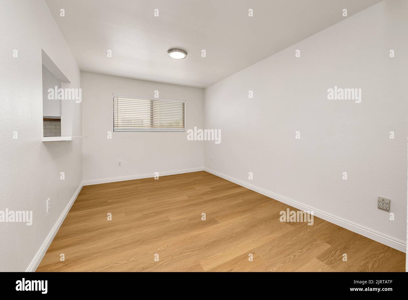 An interior of an empty room with with white walls Stock Photo - Alamy