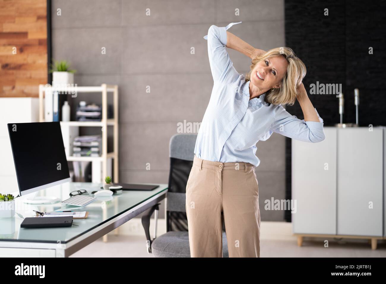 Stretching Office Workout. Desk Stretch Exercise At Workplace Stock ...