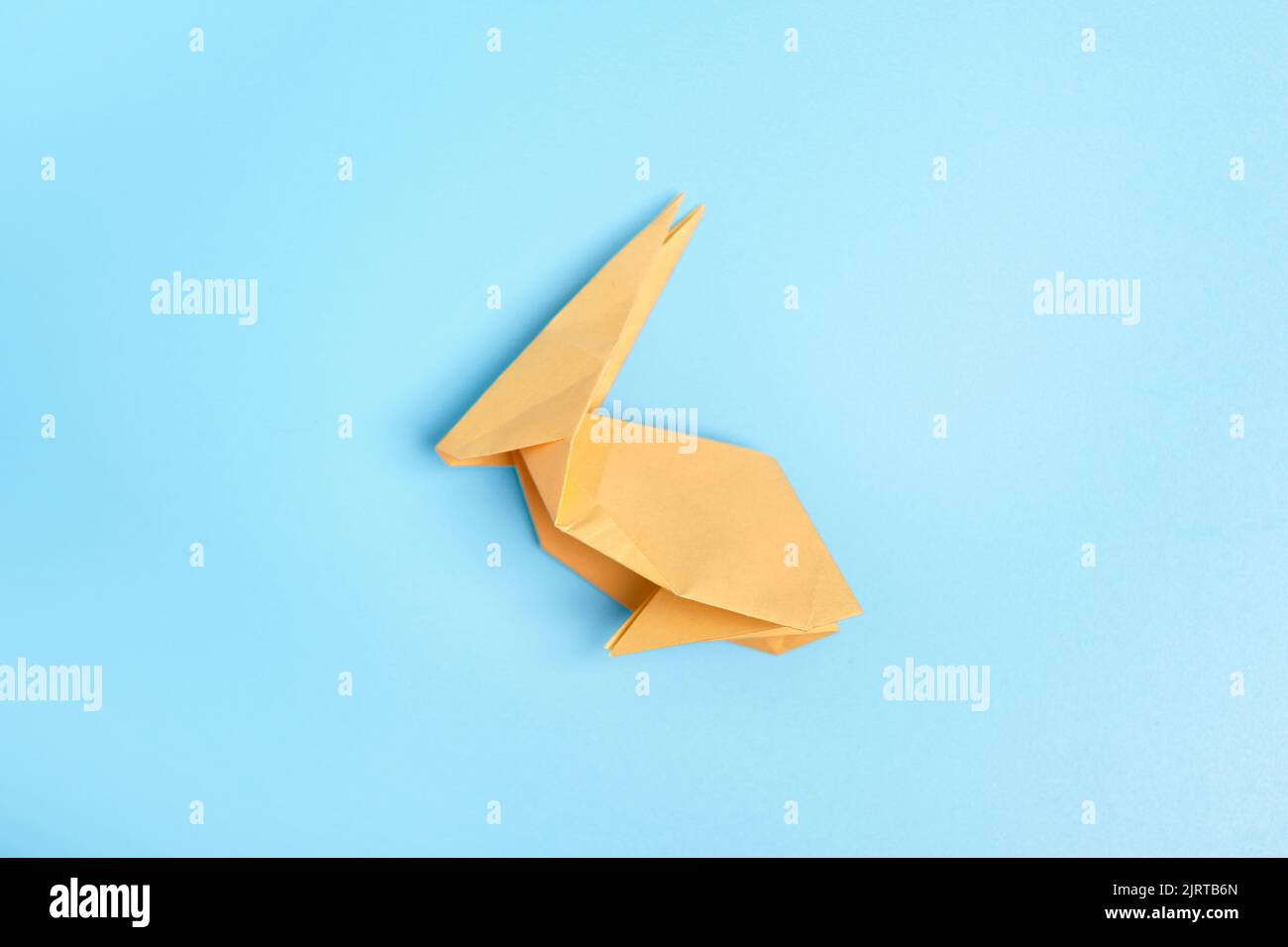 Origami Bunny. Step-by-step photo instruction on a blue background ...