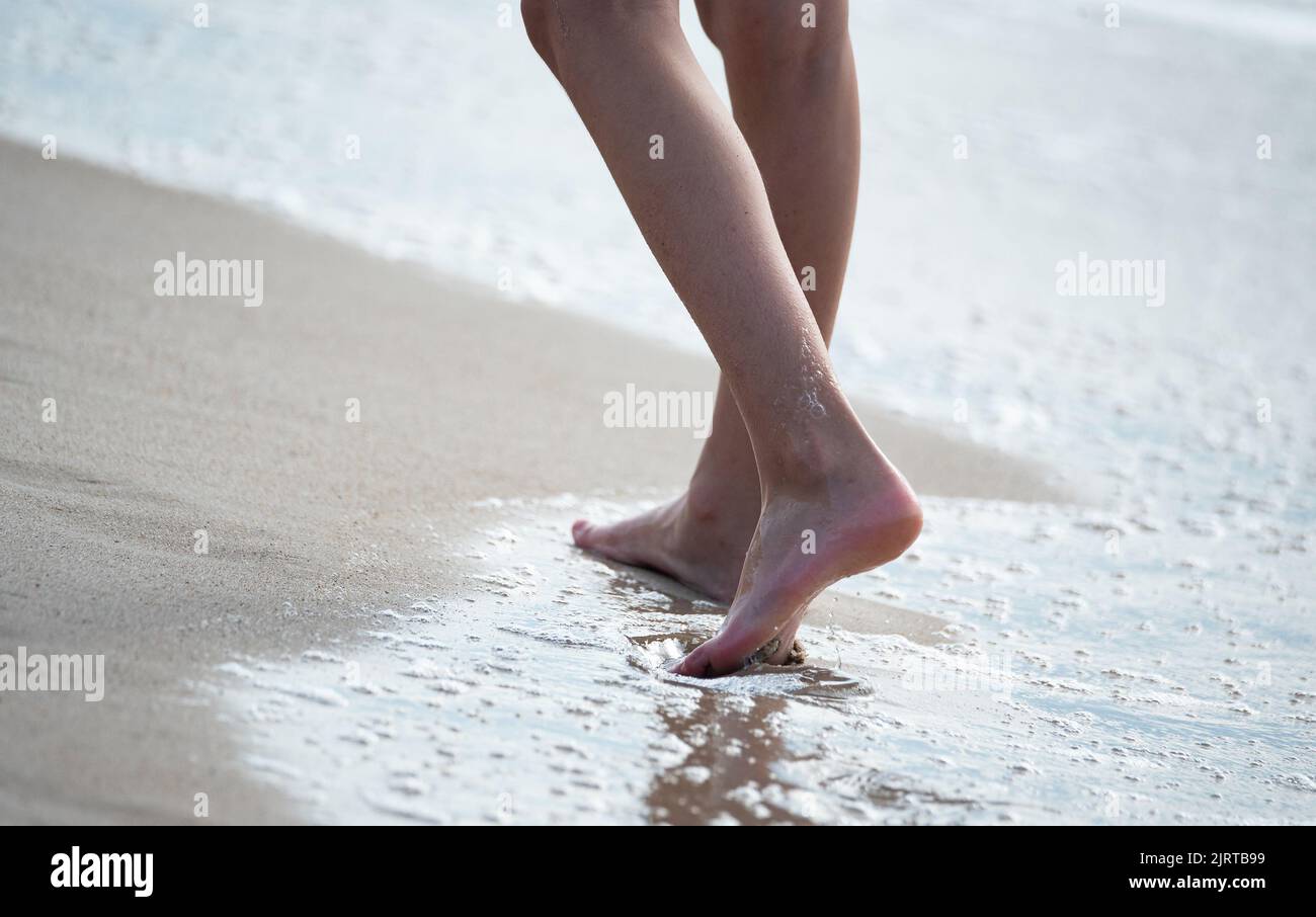 Traces of children's feet in the wet sand at the beach. Sandy beach ...