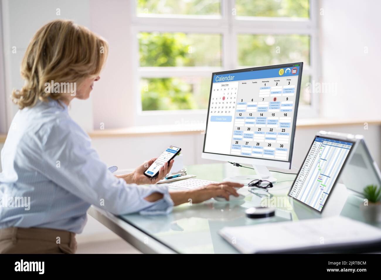 Employee Working On Calendar Schedule And Staff Time Sheet Stock Photo ...
