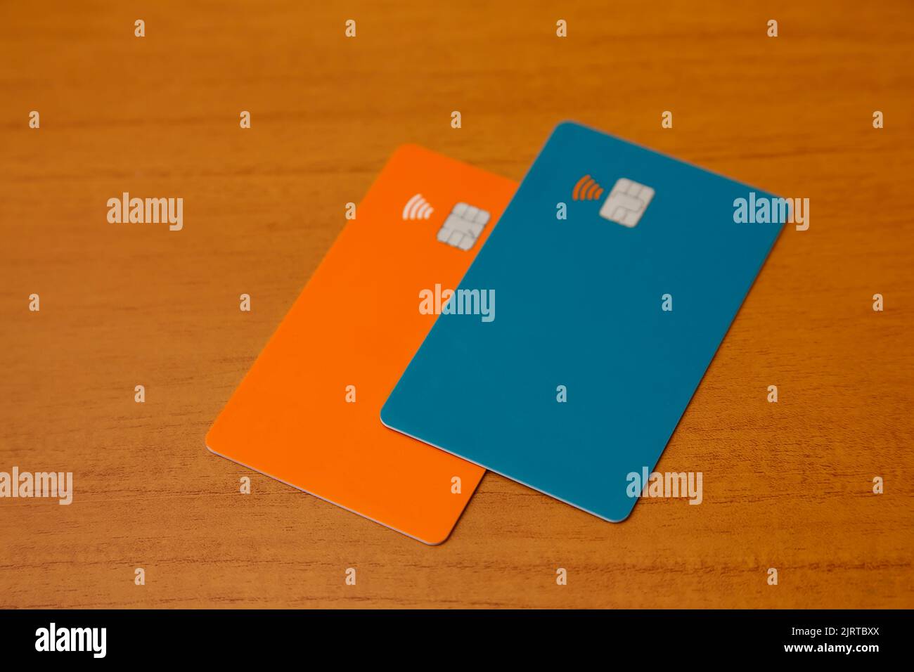 green and orange credit or debit contactless cards with contact less ...