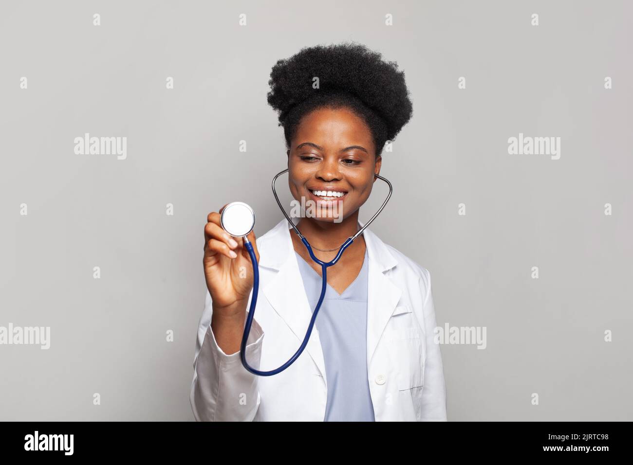 Doctor medical professional worker holding stethoscope on white ...