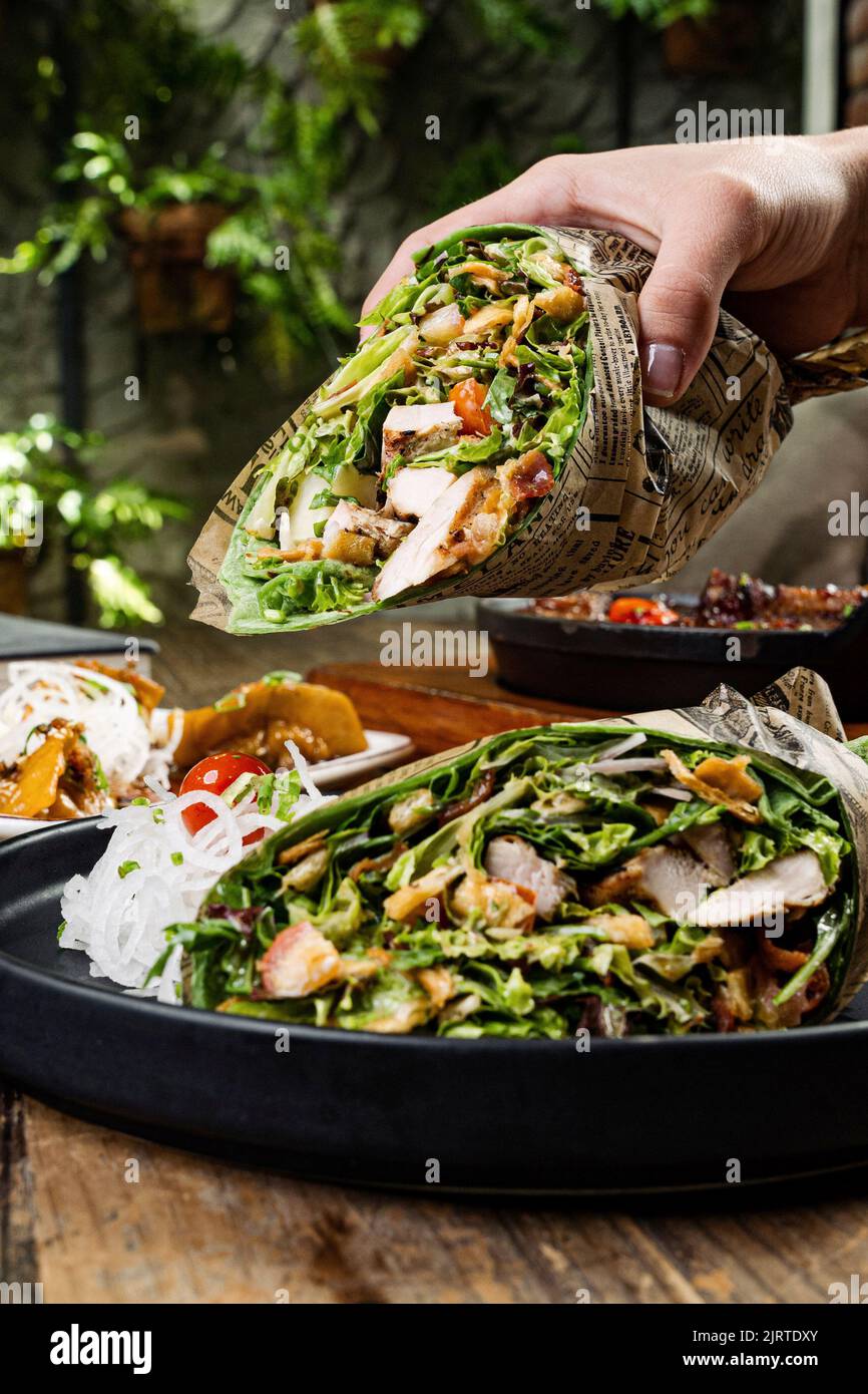 Delicious chicken spinach wrap with vinaigrette Stock Photo - Alamy