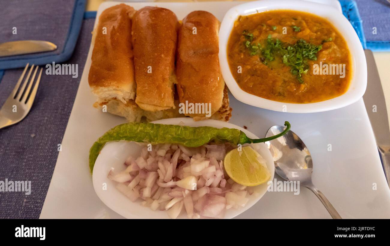 Pav bhaji fast food dish from India. Consists of a thick vegetable ...