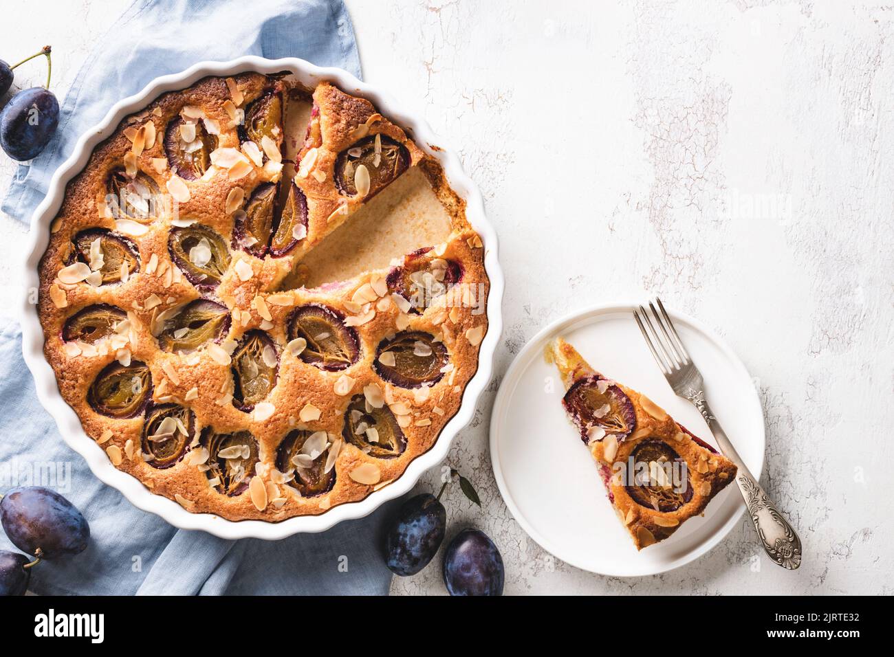 Traditional American plum torte on white table Stock Photo - Alamy