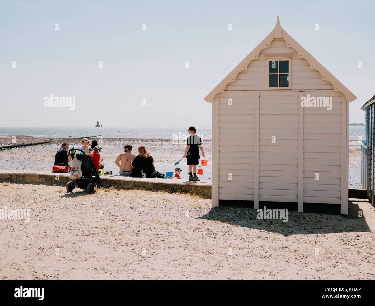 A family enjoying a summer day at the beach at West Mersea, Mersea ...