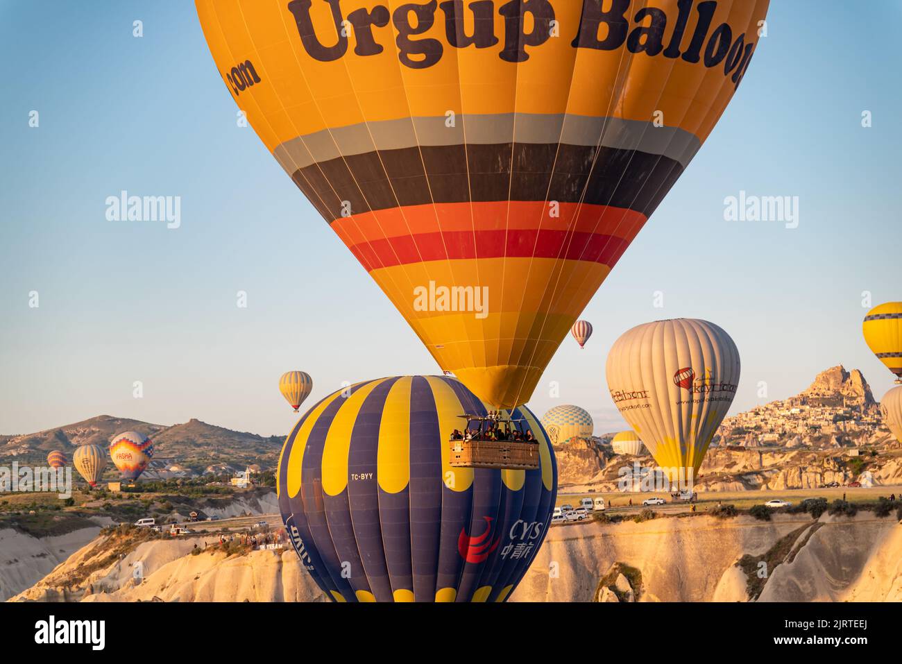 Floating hot air balloons on the sunrise in Goreme, Turkey Stock Photo ...