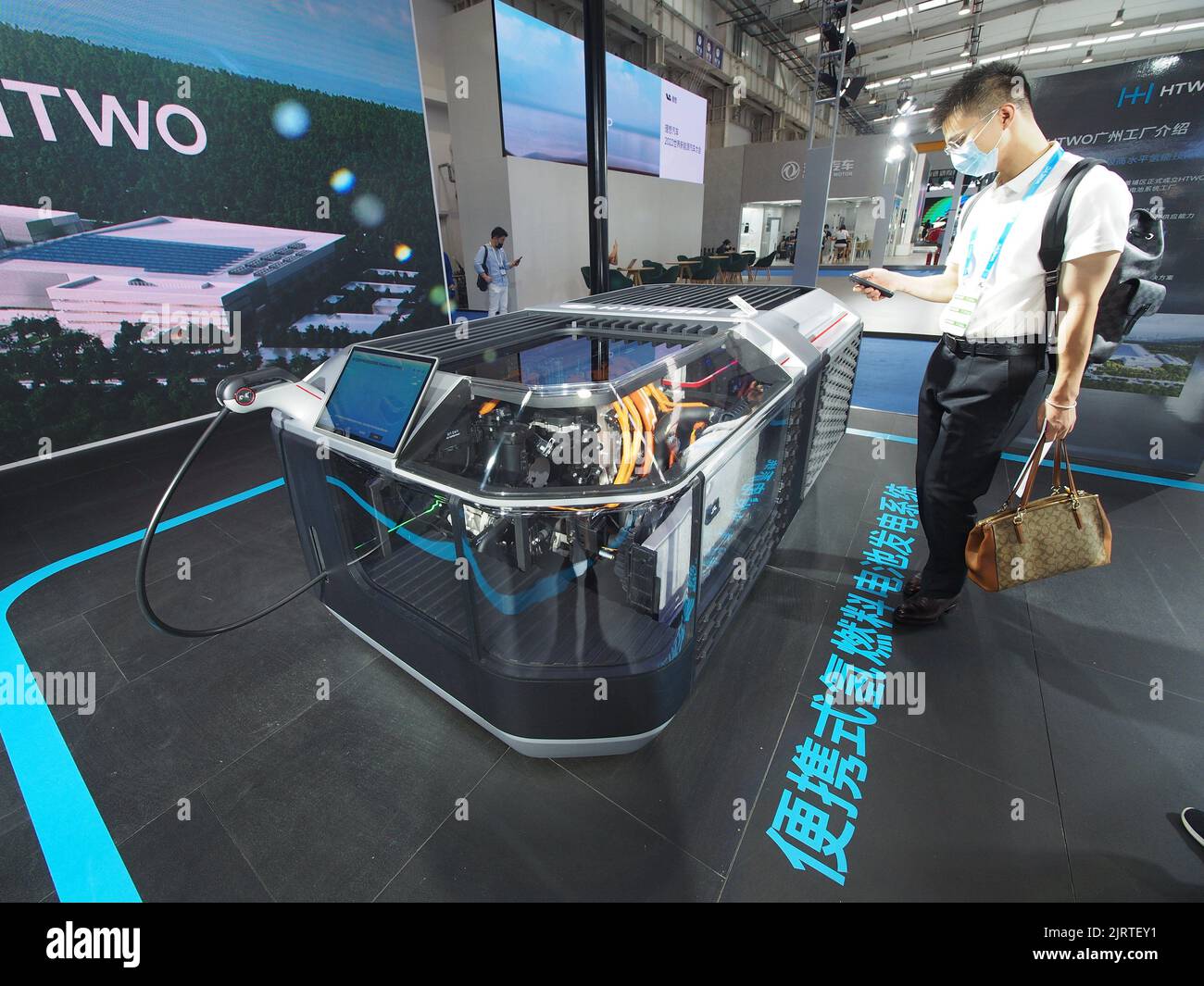 BEIJING, CHINA - AUGUST 26, 2022 - Visitors view a portable hydrogen ...