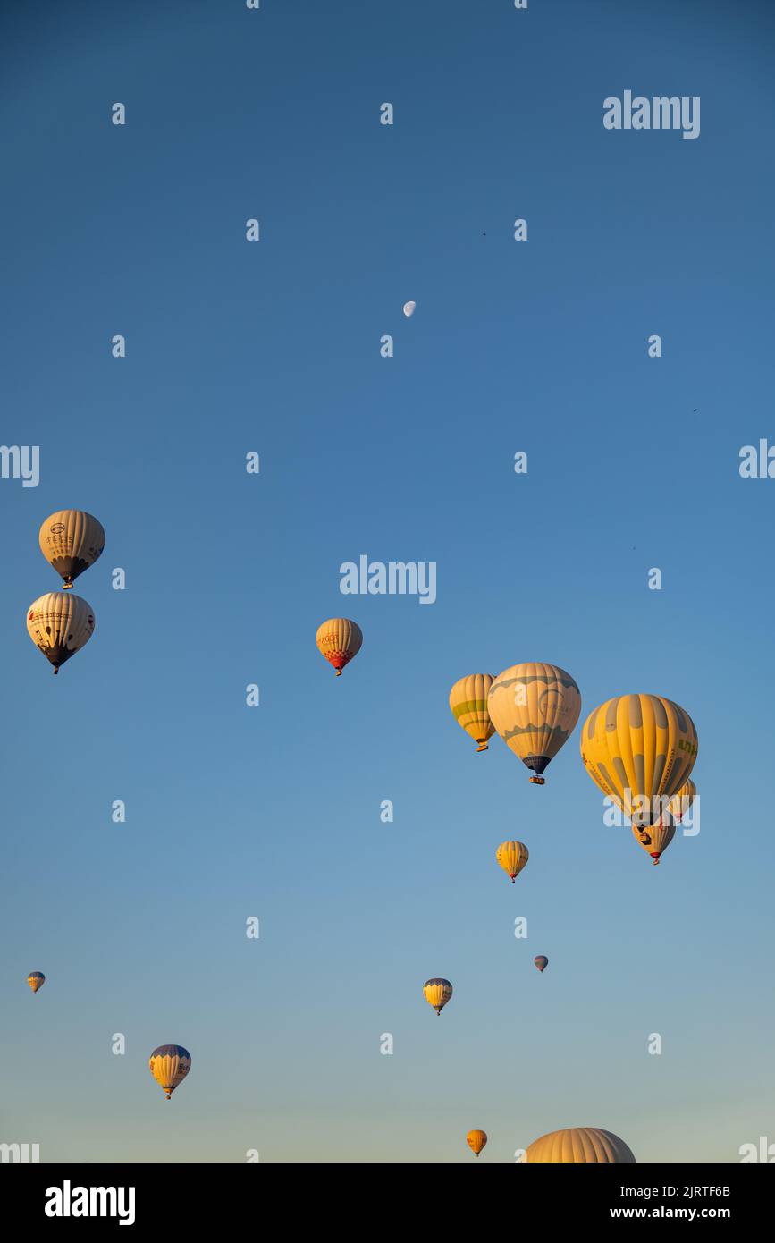 Floating hot air balloons on the sunrise above the valley in Goreme, Turkey Stock Photo - Alamy