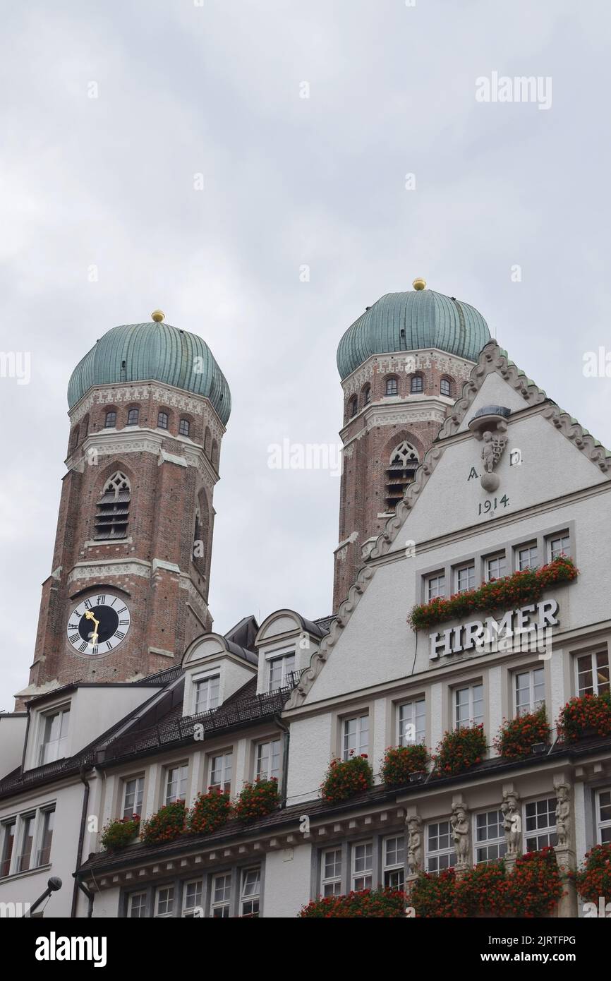 Buildings of Shopping Mall called Hirmer and towers of cathedral church ...
