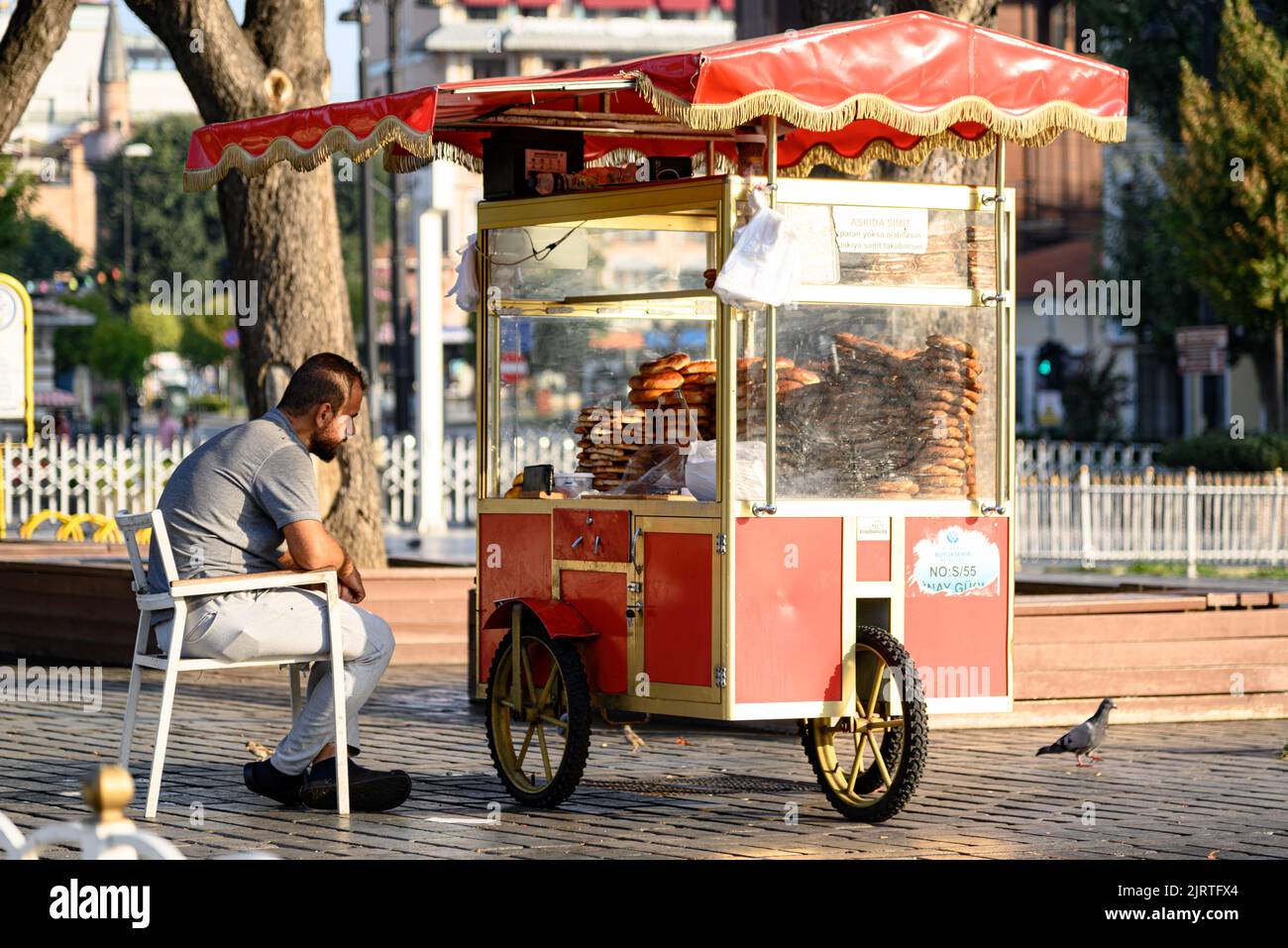 A simit seller sits on the Sultanahmet area in the morning In Istanbul ...