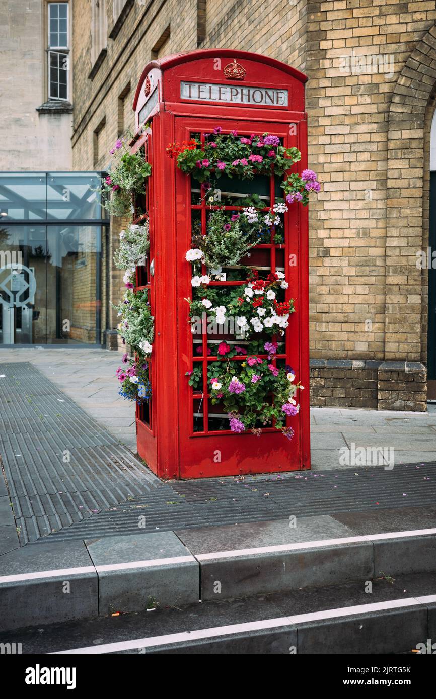 British red phone box planted with flowers in Bath (Aug22 Stock Photo ...