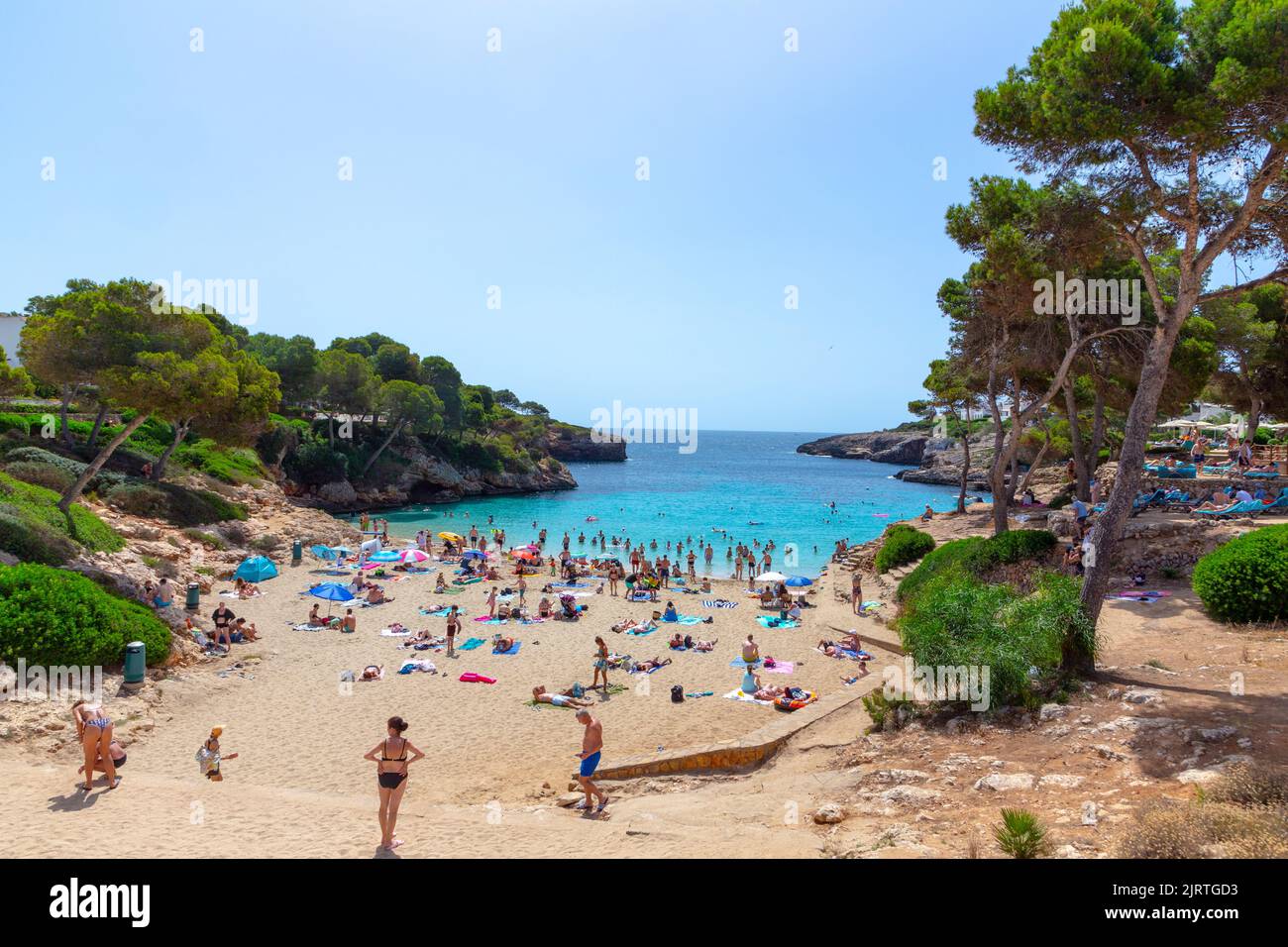 Cala d'Or, Spain - June 22, 2022: people enjoy swimming and relaxing at ...