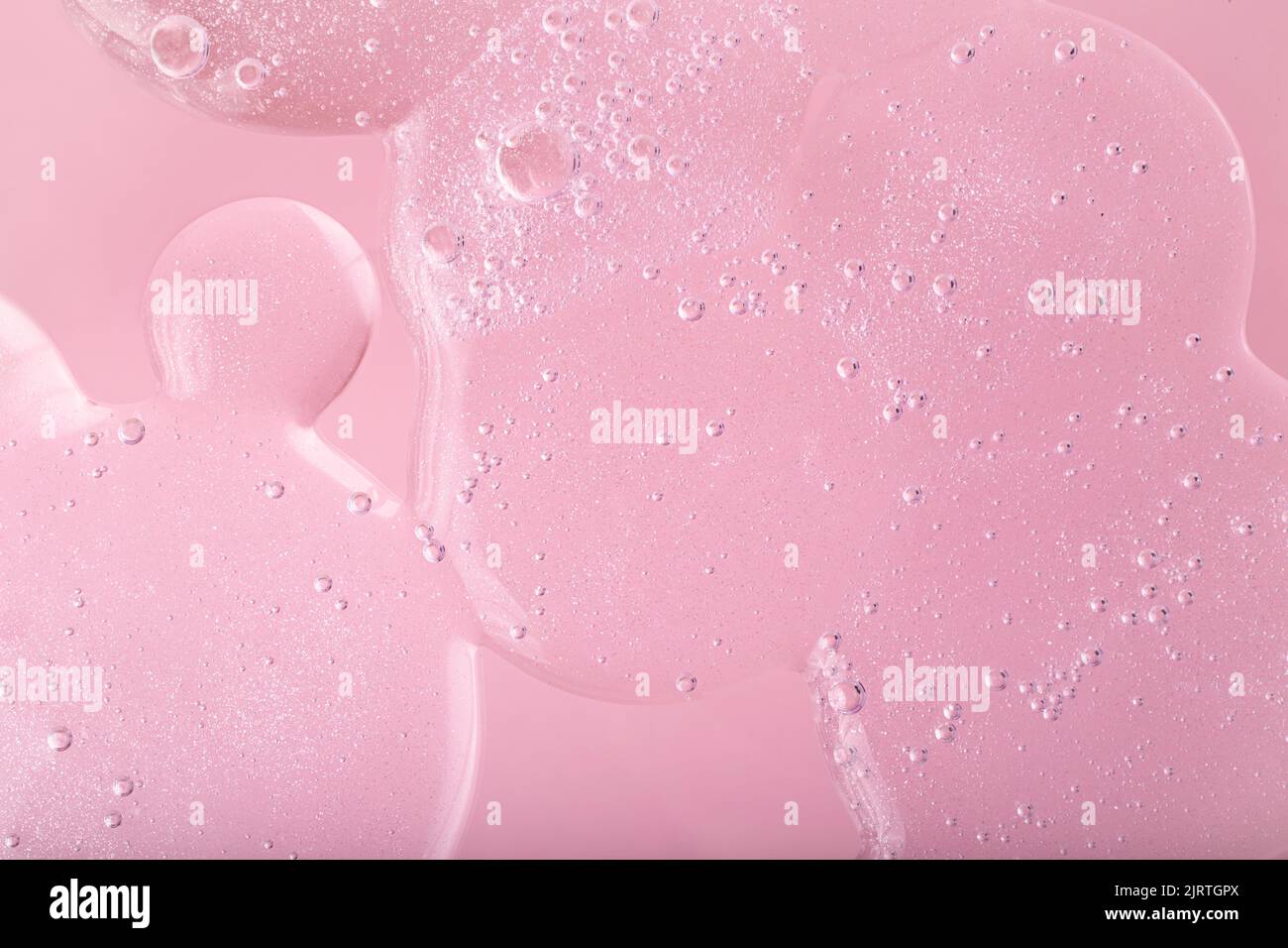 Macro photography of bubbly smear on raspberry pink background Stock ...