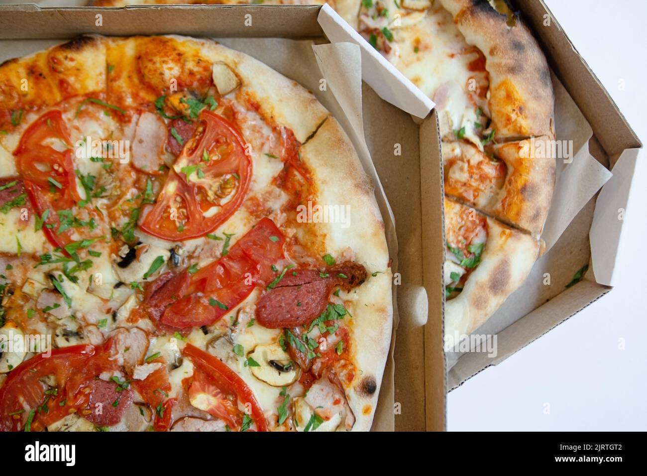 Top view of two pizzas in the cardboard. Food delivery concept Stock ...
