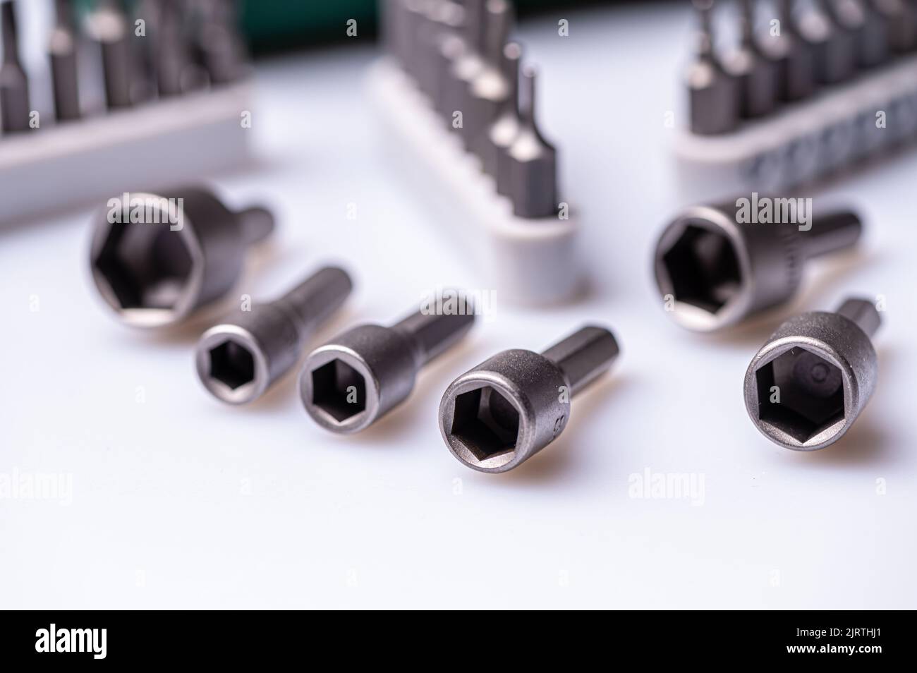 Interchangeable screwdriver bit set, isolated on white, selective focus ...