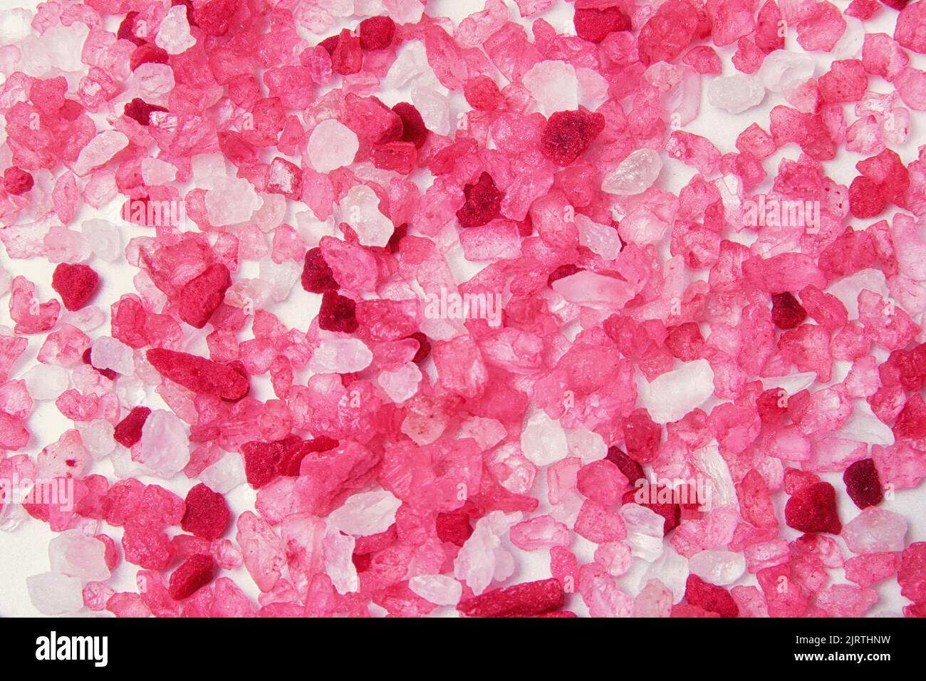 Magnesium pink spa salt scattered on the spa marble floor. Abstract ...
