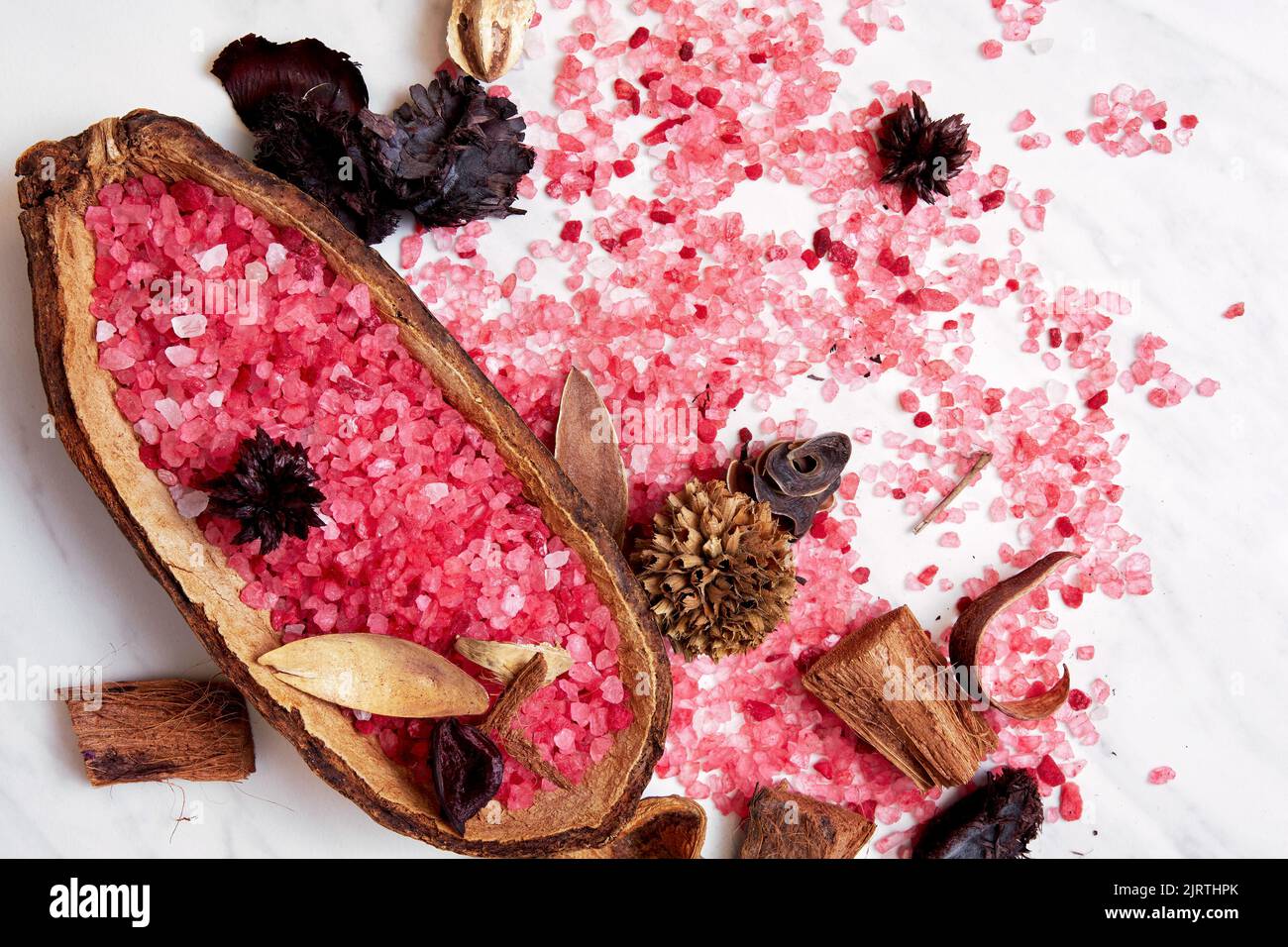 Iodized pink bath salt, dried plants and herbs, flowers,coconut and ...