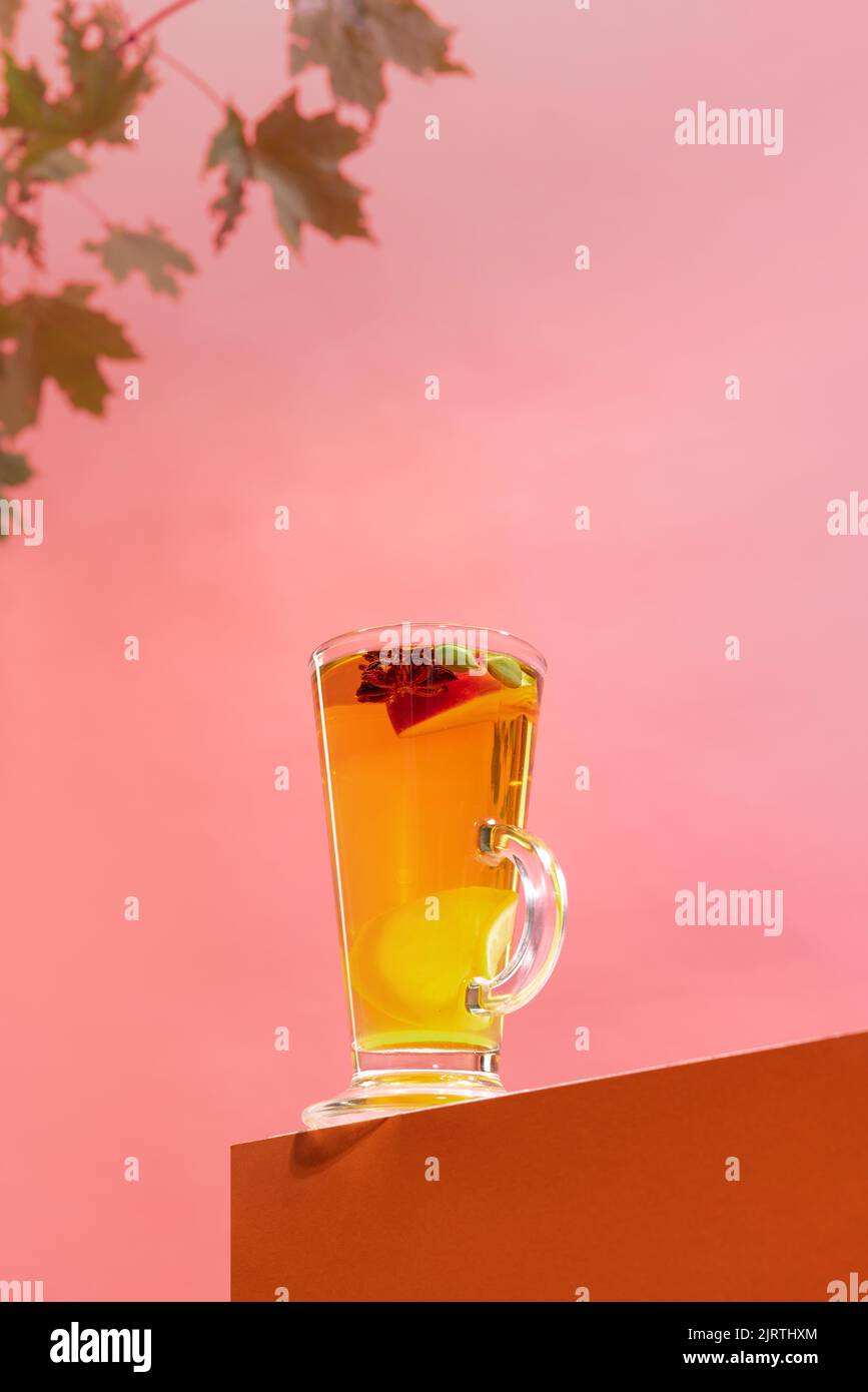 Glass of delicious aromatic fruit tea with citrus, lemons, mango, honey ...
