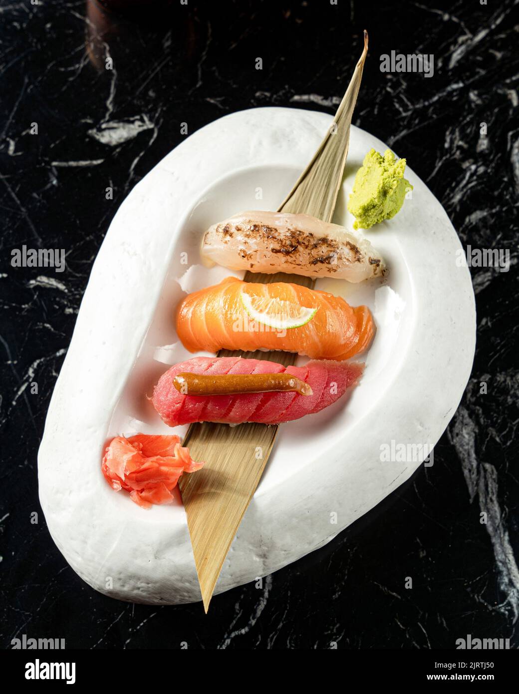 A vertical shot of tuna, fish and salmon nigiri Stock Photo - Alamy