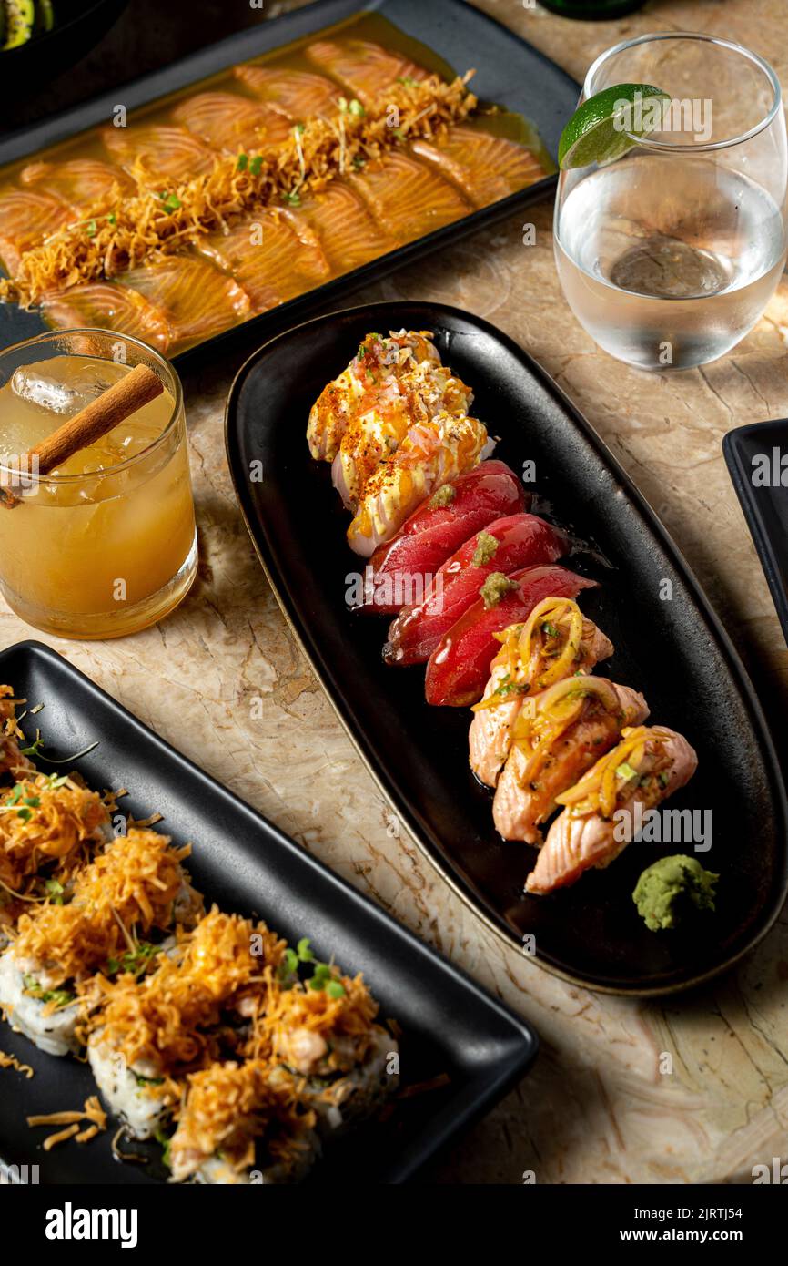 A vertical shot of a table full of Asian food in a restaurant Stock ...