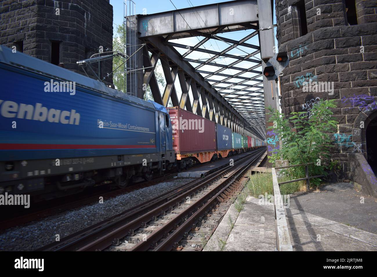 freight train running across the old railroad bridge near Urmitz and ...