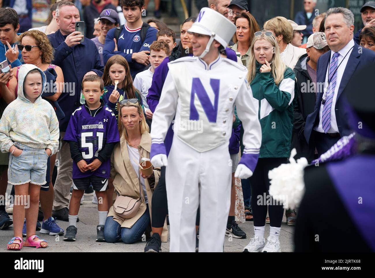 People watch on as members of the Northwestern University Wildcat ...