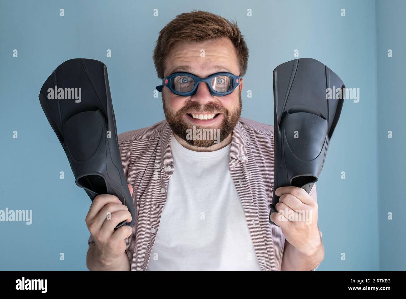 Satisfied, smiling man in anticipation of a vacation, he put on ...