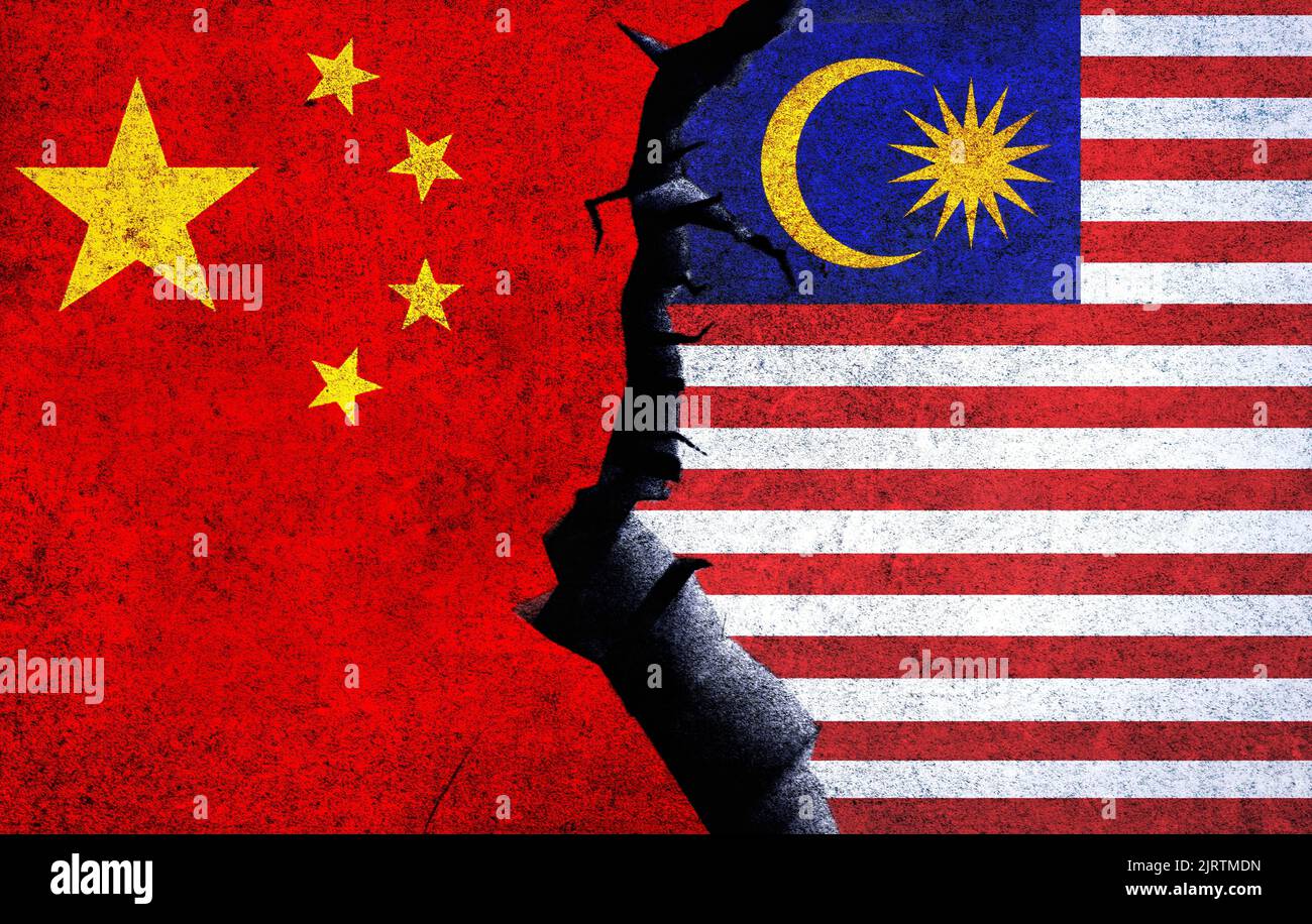 China vs Malaysia concept flags on a wall with a crack. Malaysia and ...
