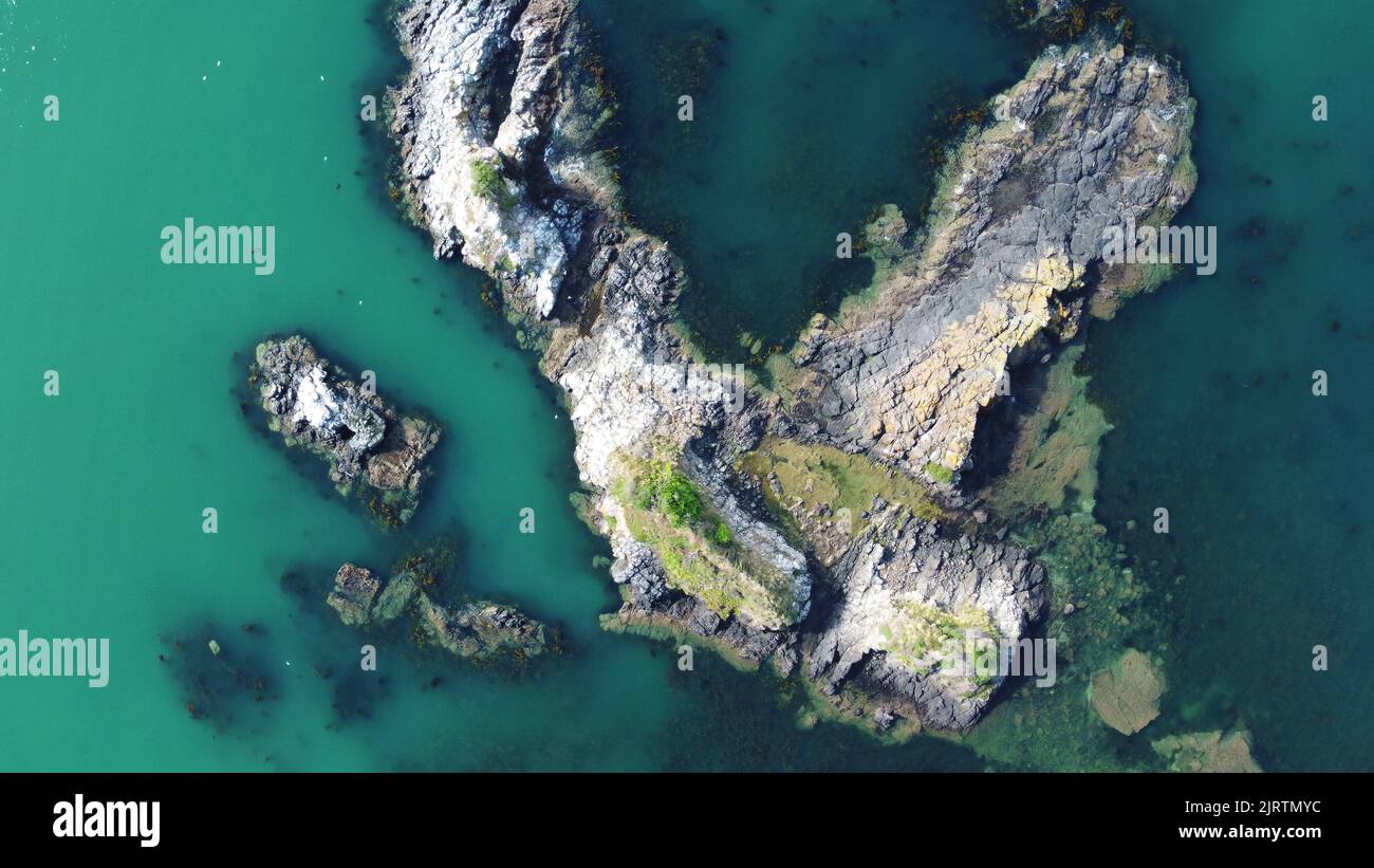 An aerial top view shot of a seascape with cliffs Stock Photo - Alamy