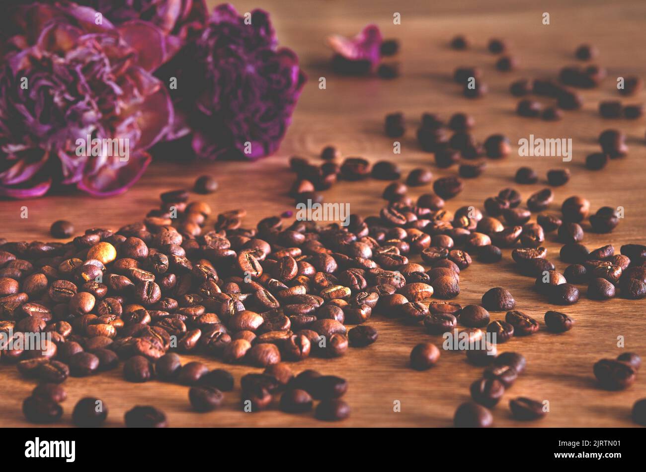 Coffee scattered on a wooden table. Background of roasted coffee beans ...