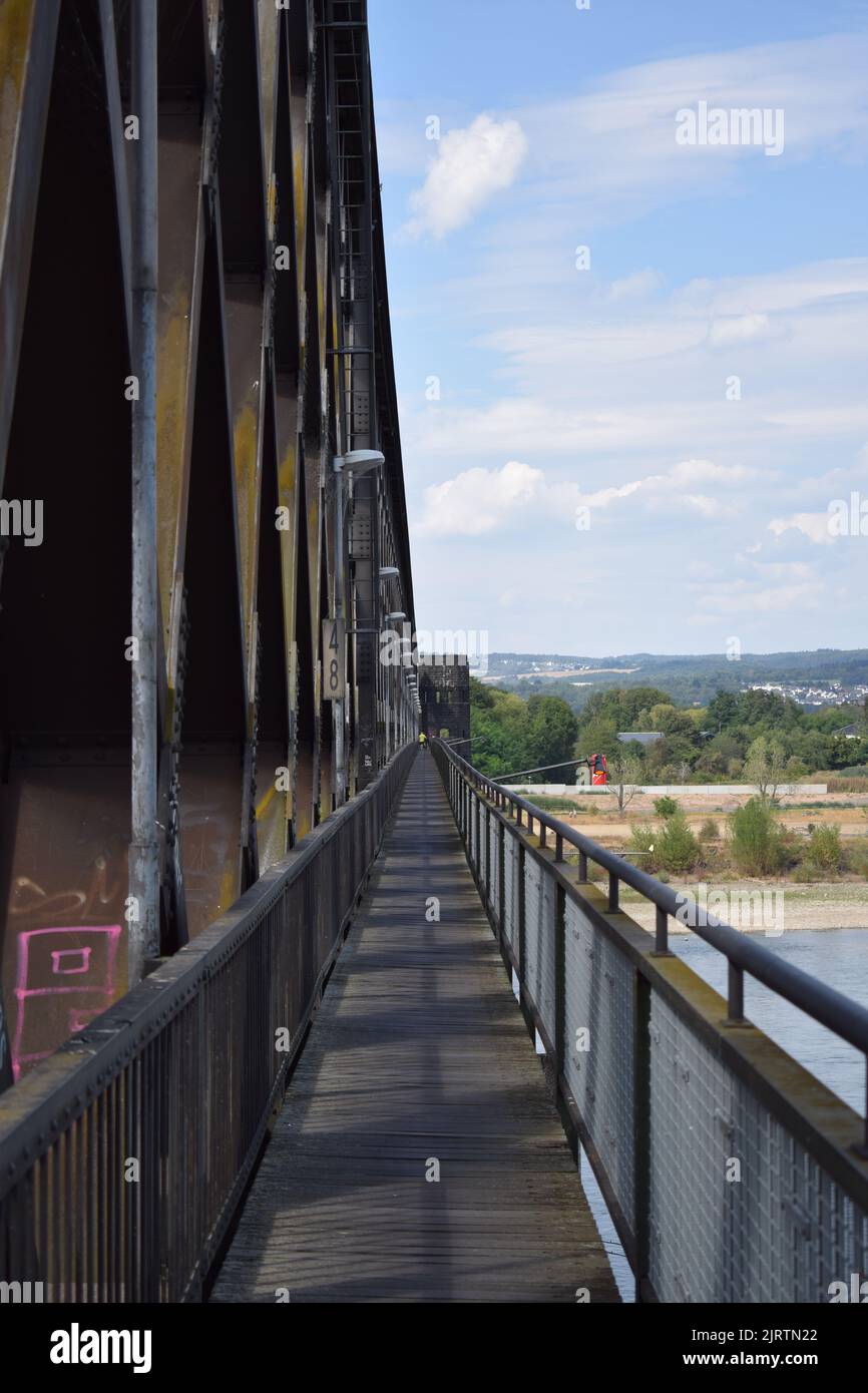 railroad bridge across the Rhine with a way to walk next to the ...