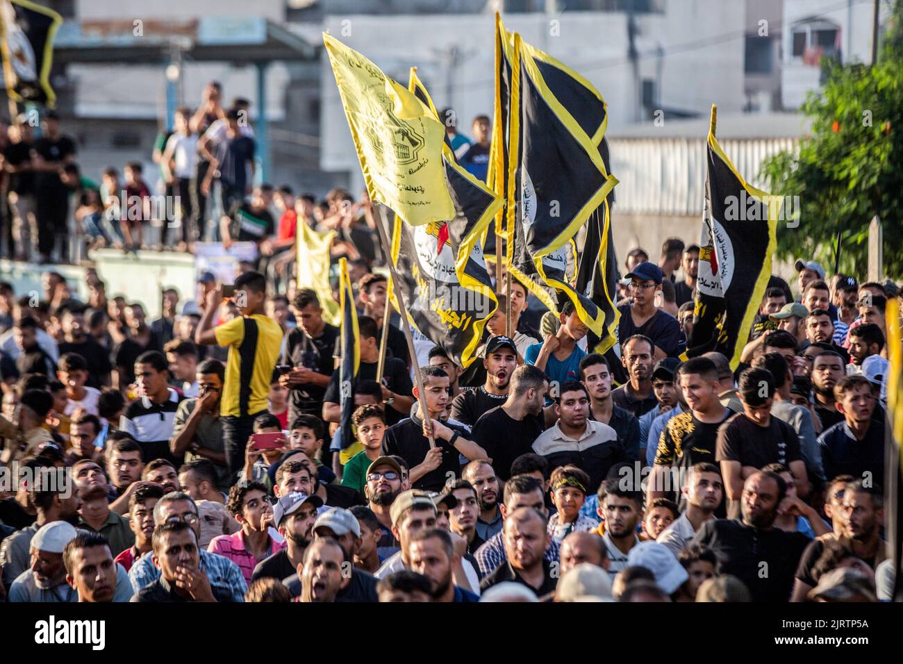 Islamic Jihad supporters wave their flags while chanting slogans during ...