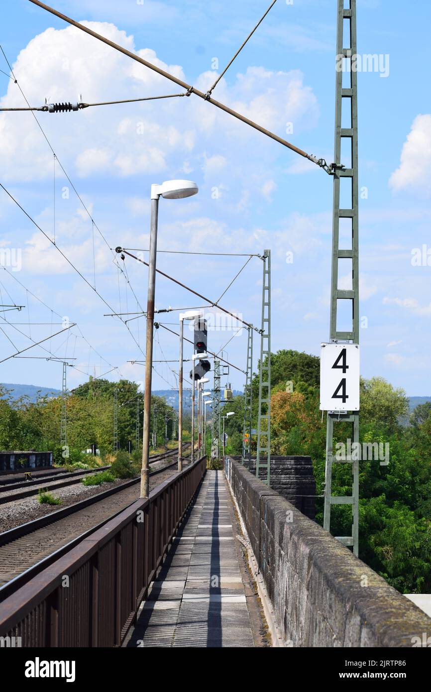 railroad bridge across the Rhine with a way to walk next to the ...