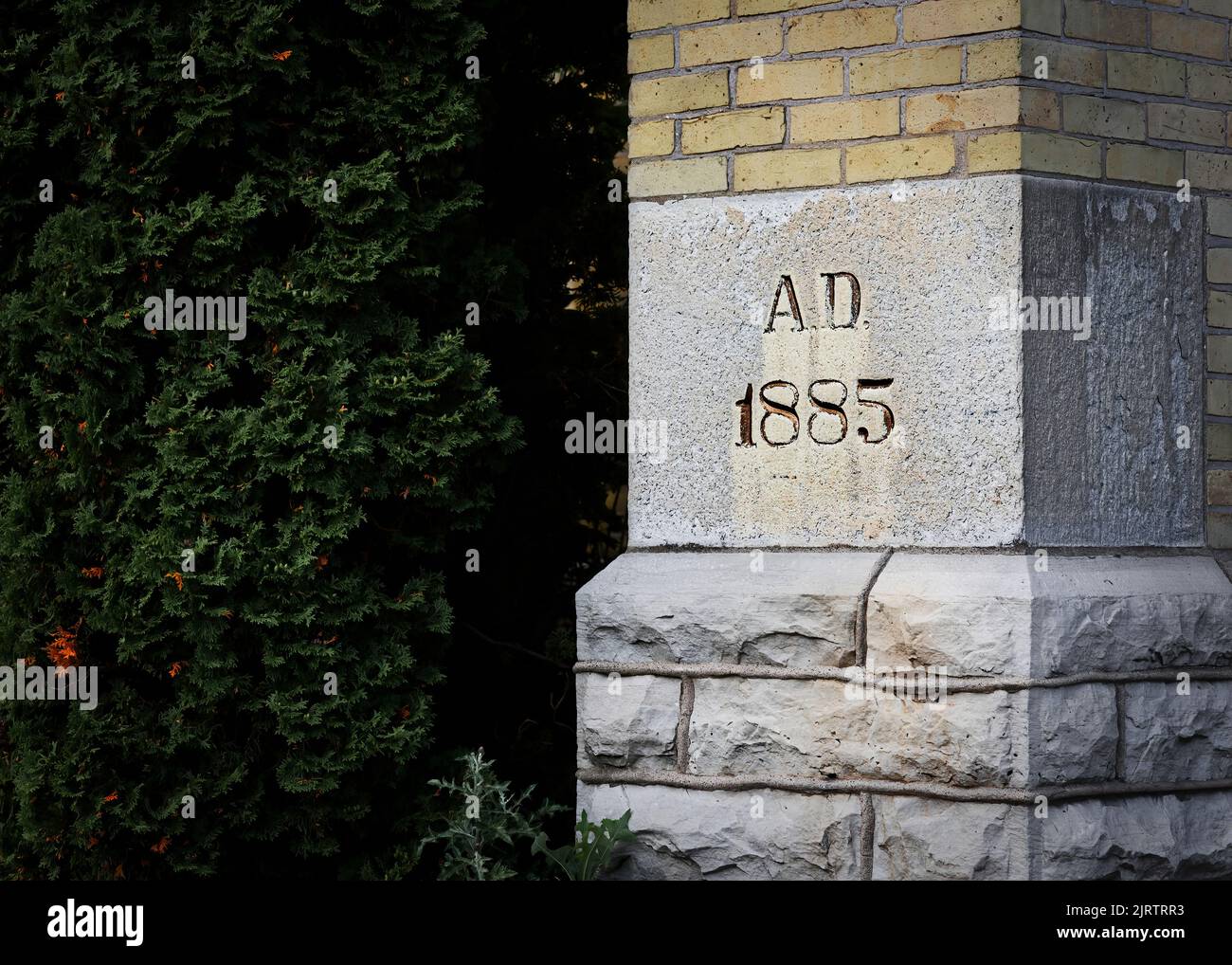 The bricks and cornerstone of a building built in 1885 stands in ...