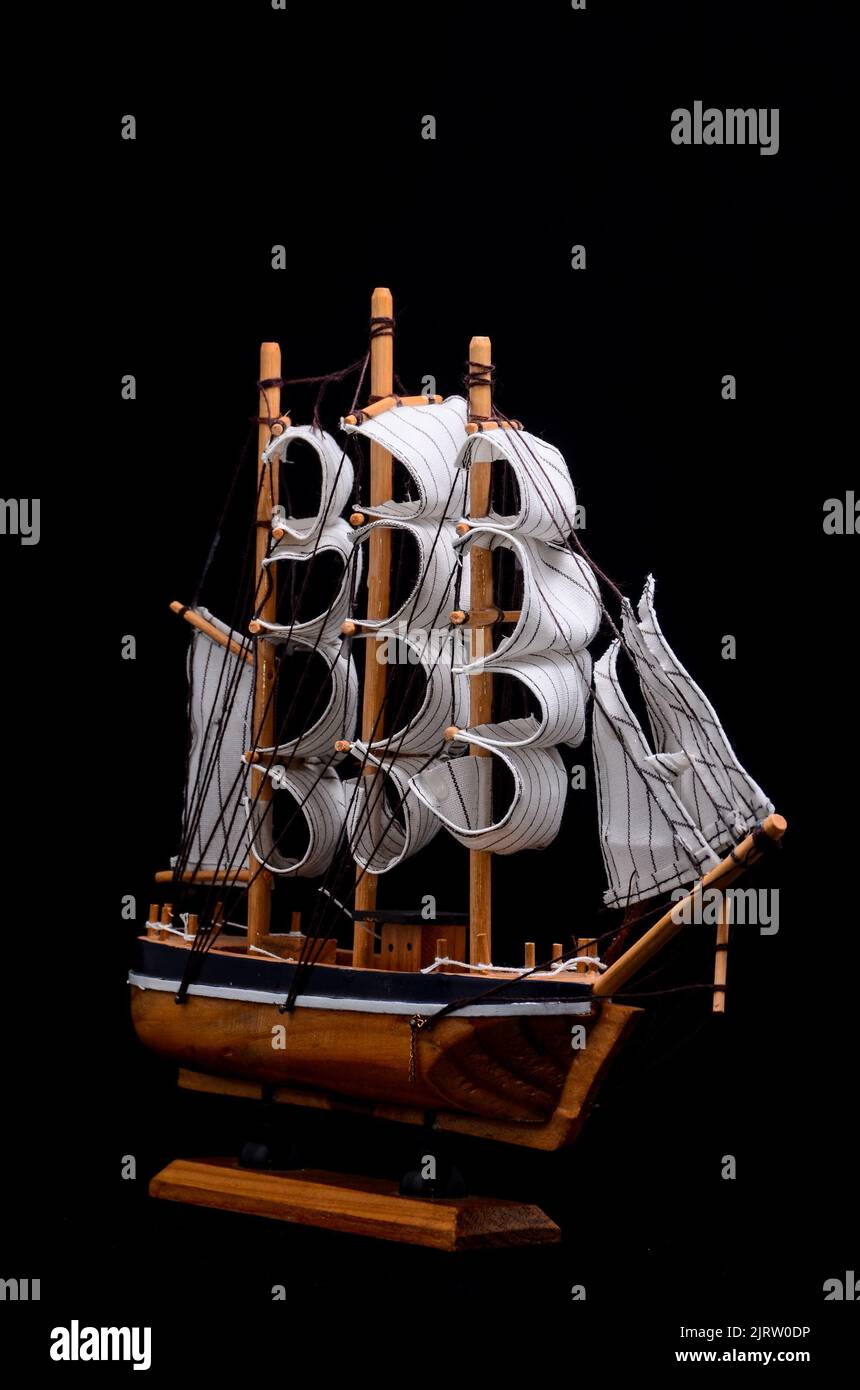 Ship Sailboat Wooden Model Figurine on a Black Background Stock Photo ...
