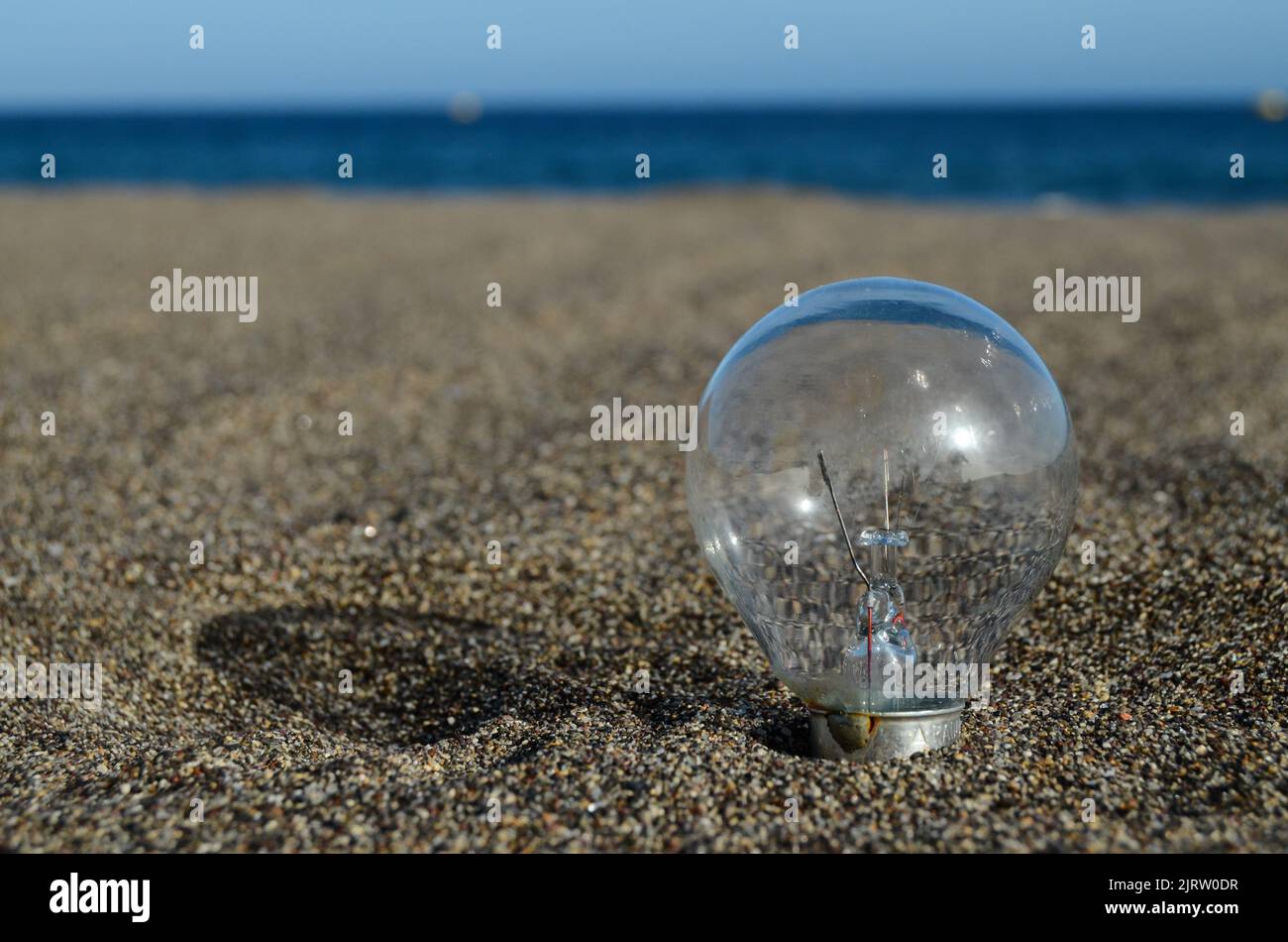 Light bulb on the beach Idea Concept Stock Photo - Alamy