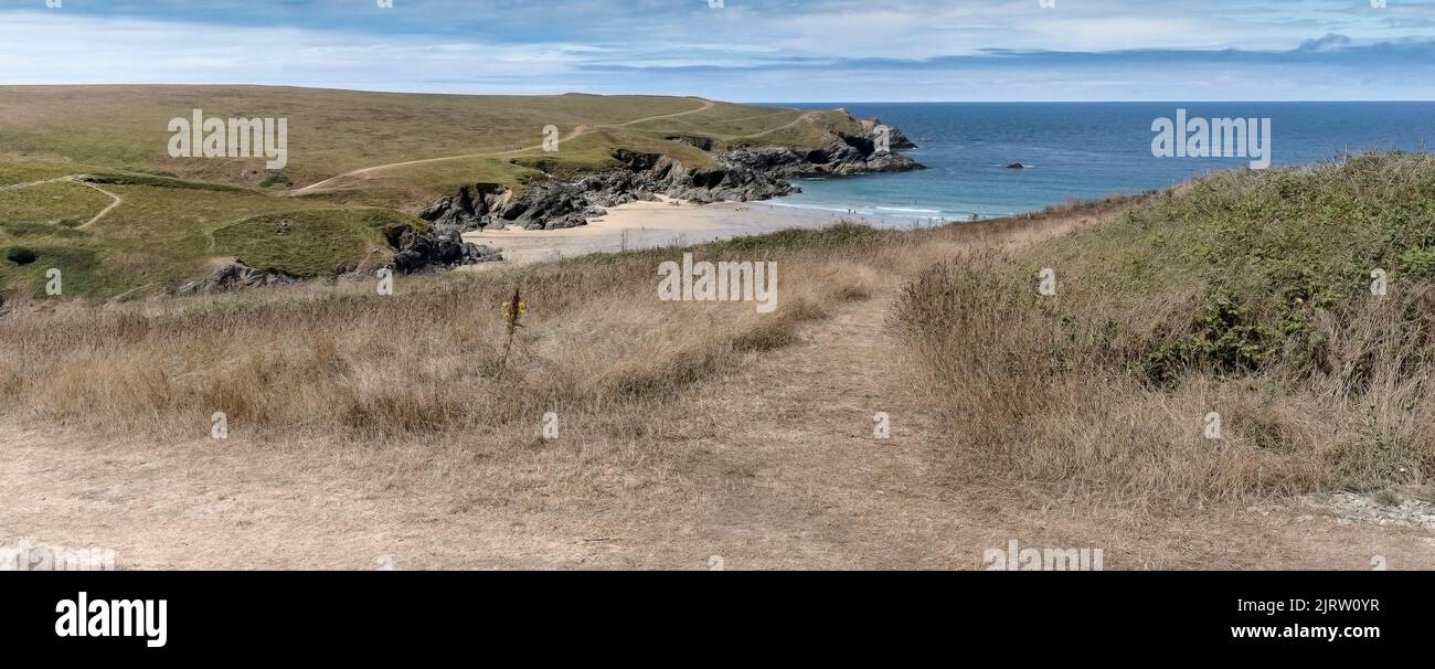 A panoramic image of rough footpaths through a field overlooking Polly ...