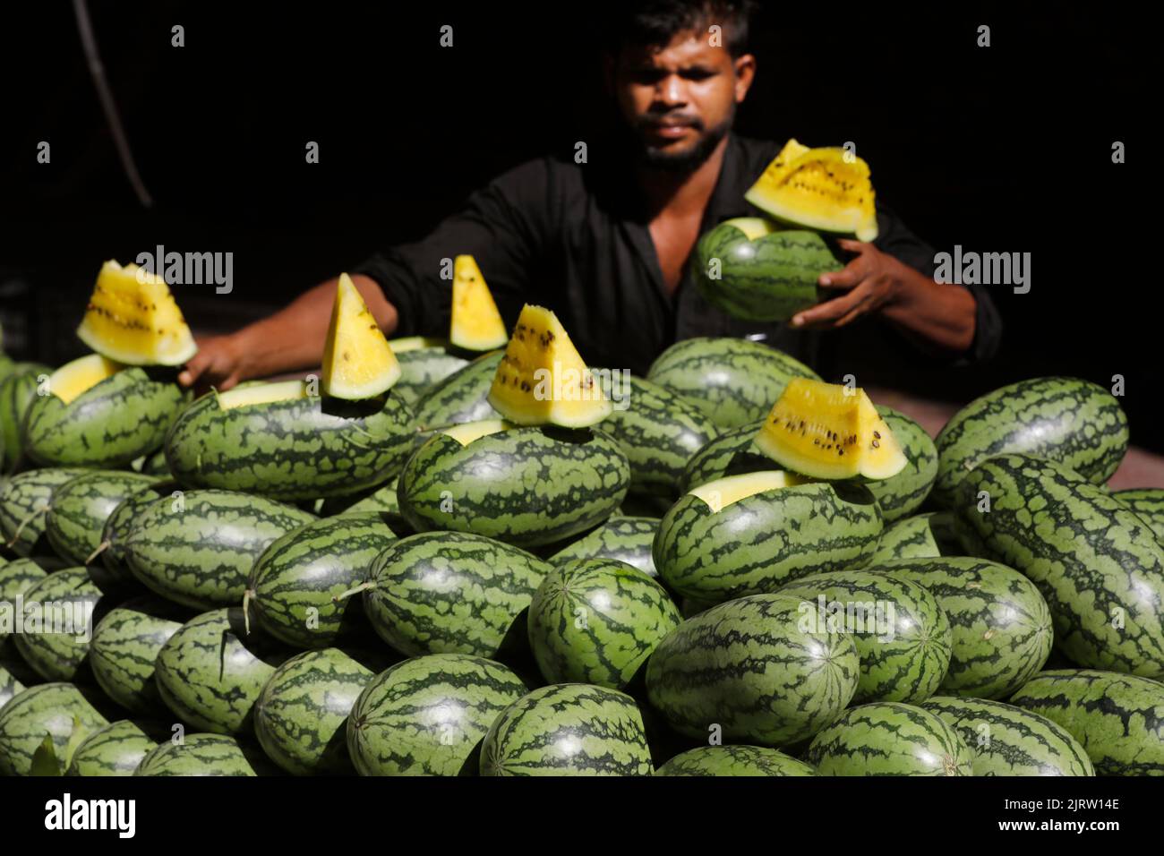 Dhaka, Bangladesh - August 24, 2022: In the sweltering heat, yellow ...
