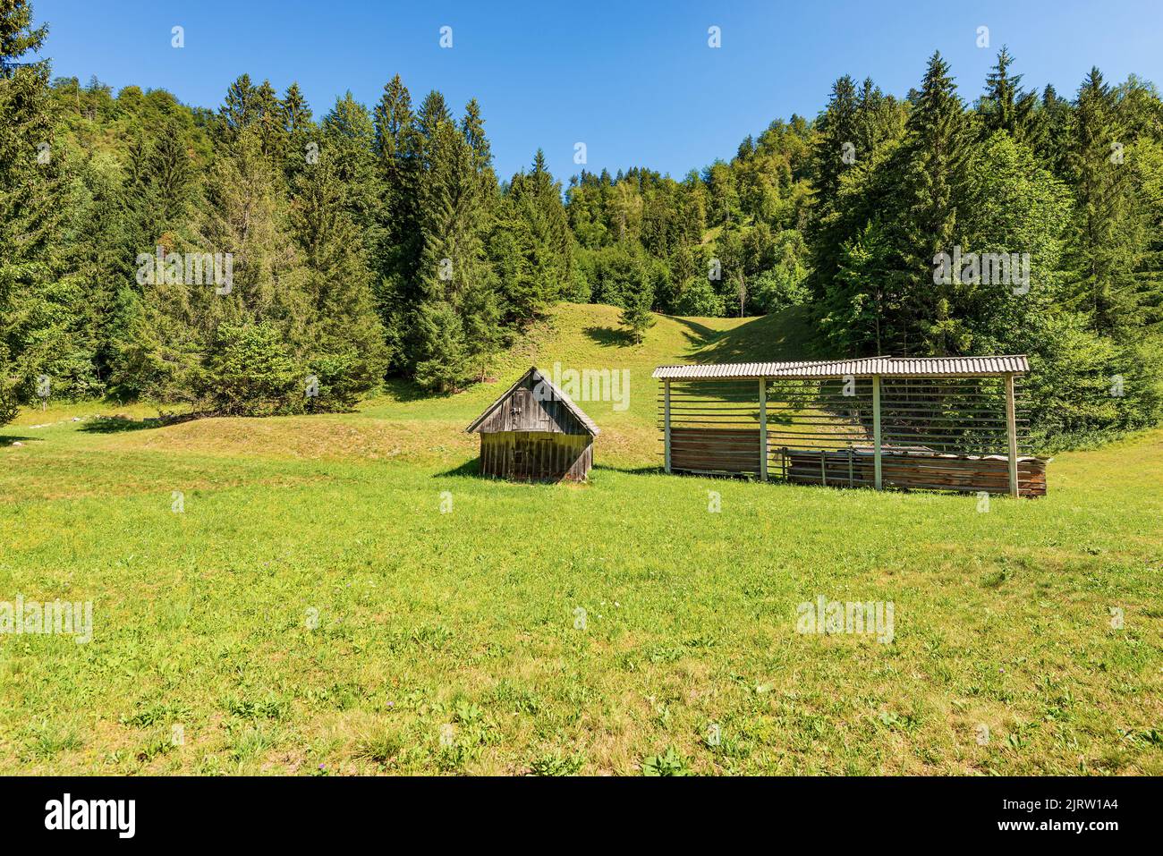 Old traditional wooden barn and vertical hay rack (Kozolec - hayrack ...