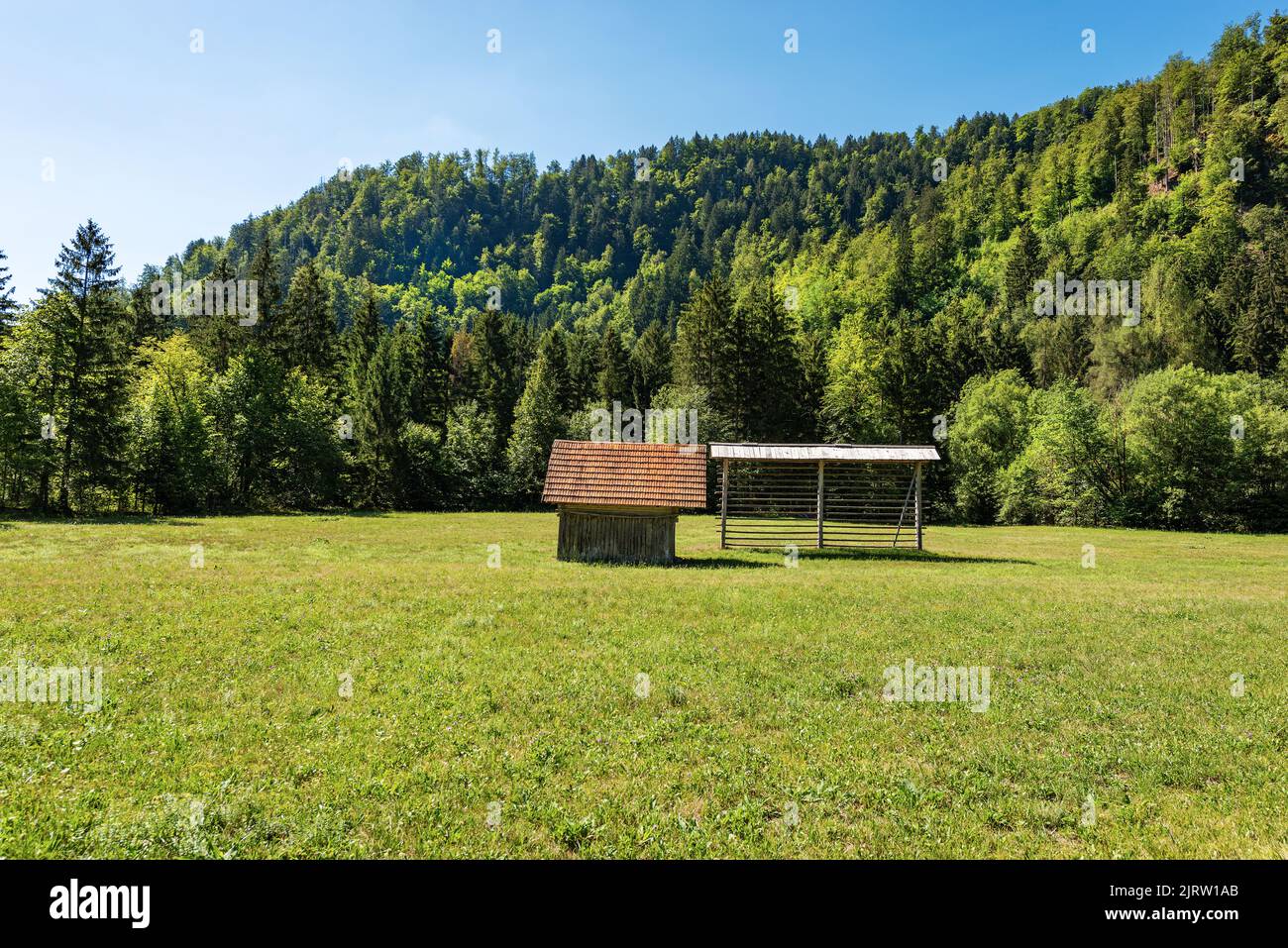 Old traditional wooden barn and vertical hay rack (Kozolec - hayrack ...
