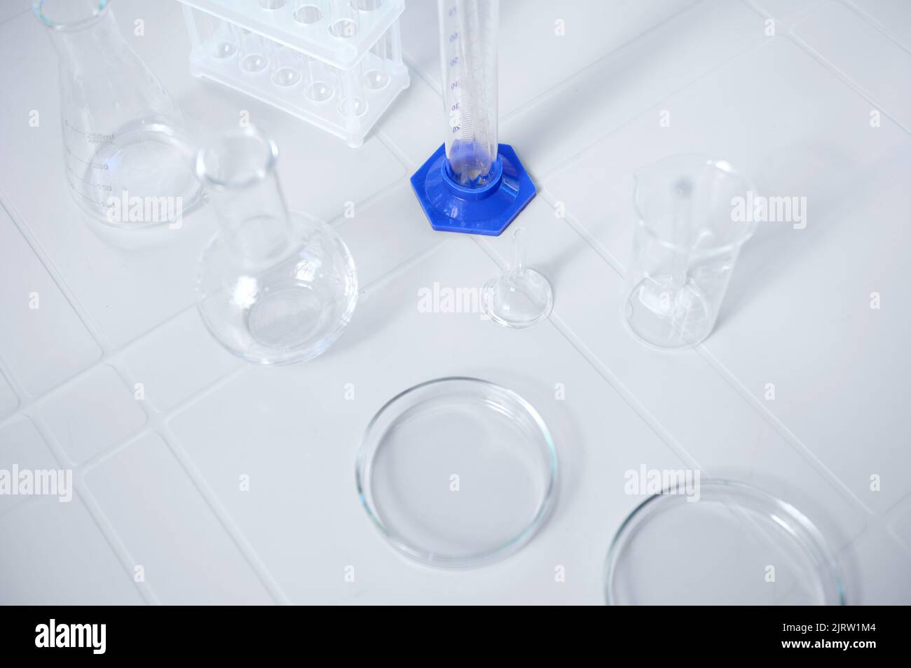 Overhead view of labware for biochemical experiment. Petri dish, flasks ...