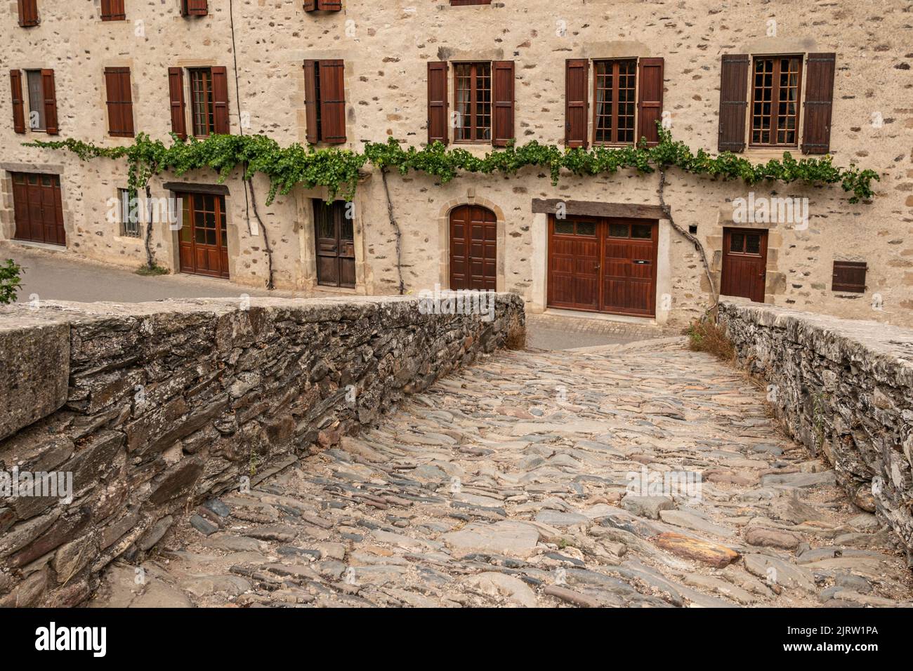 The Gothic stone bridge pont cournut of Brousse-le-Château, France ...